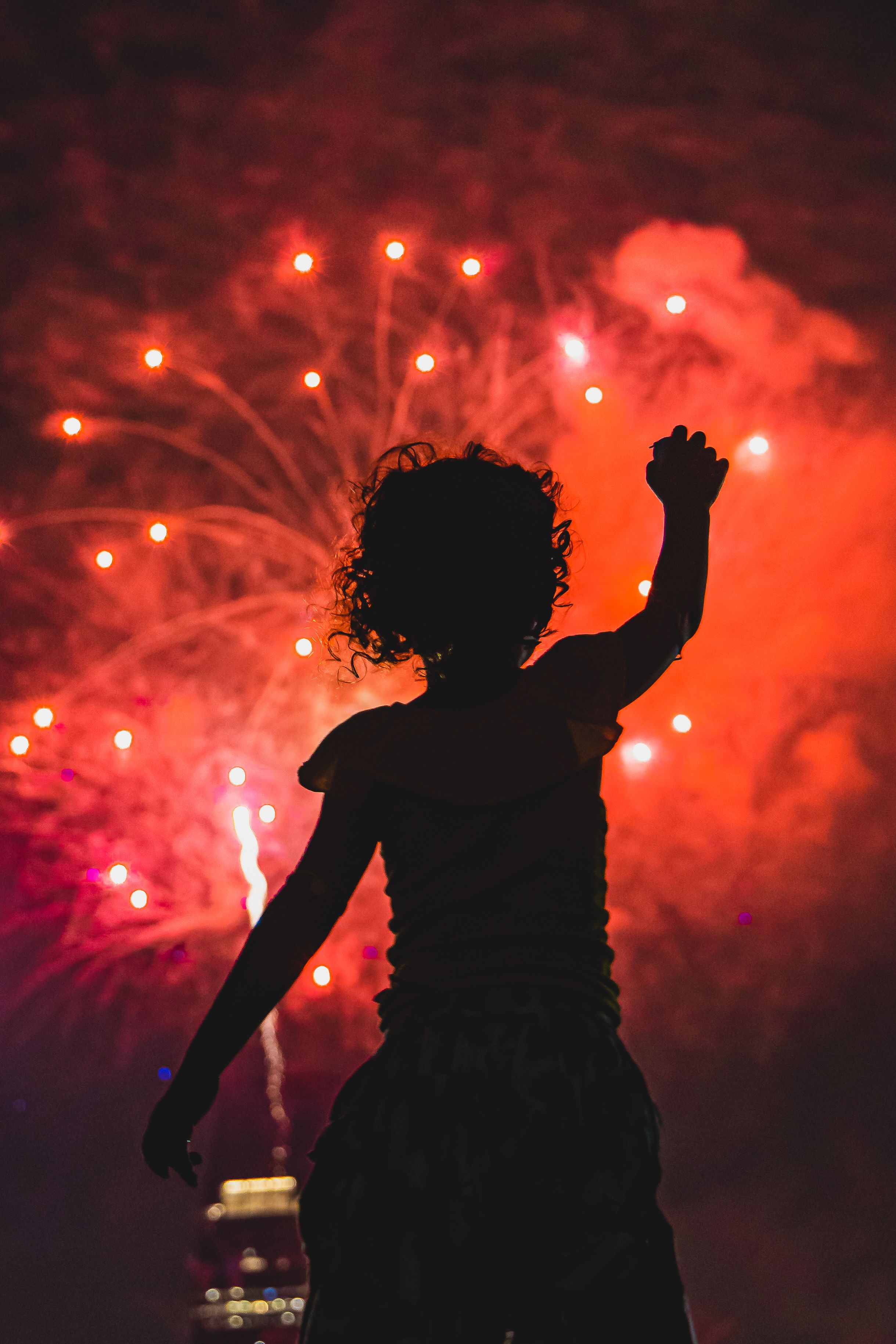 Silhouette of a Girl During Fireworks · Free Stock Photo
