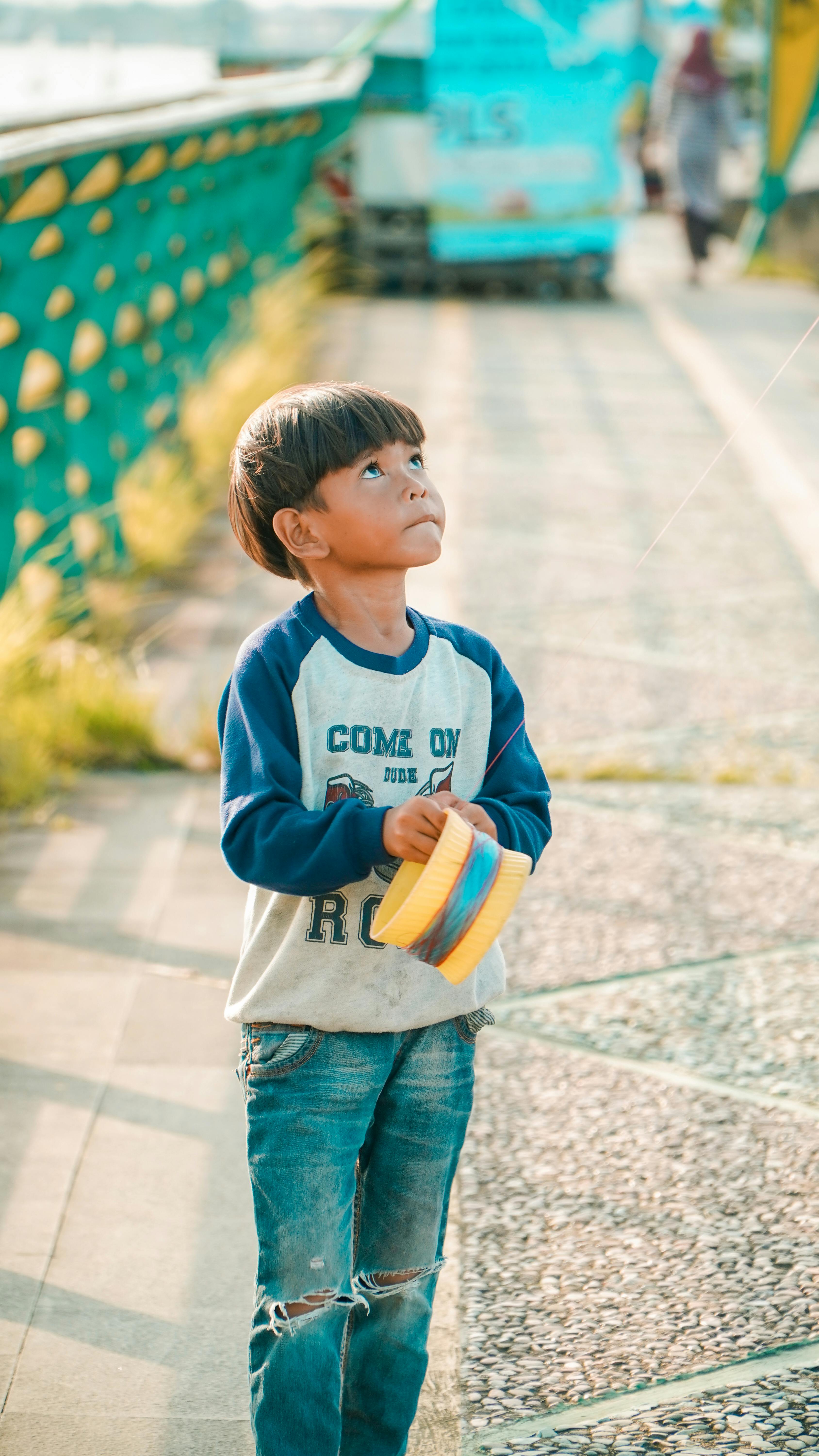 Boy Standing on Road and Looking Up · Free Stock Photo