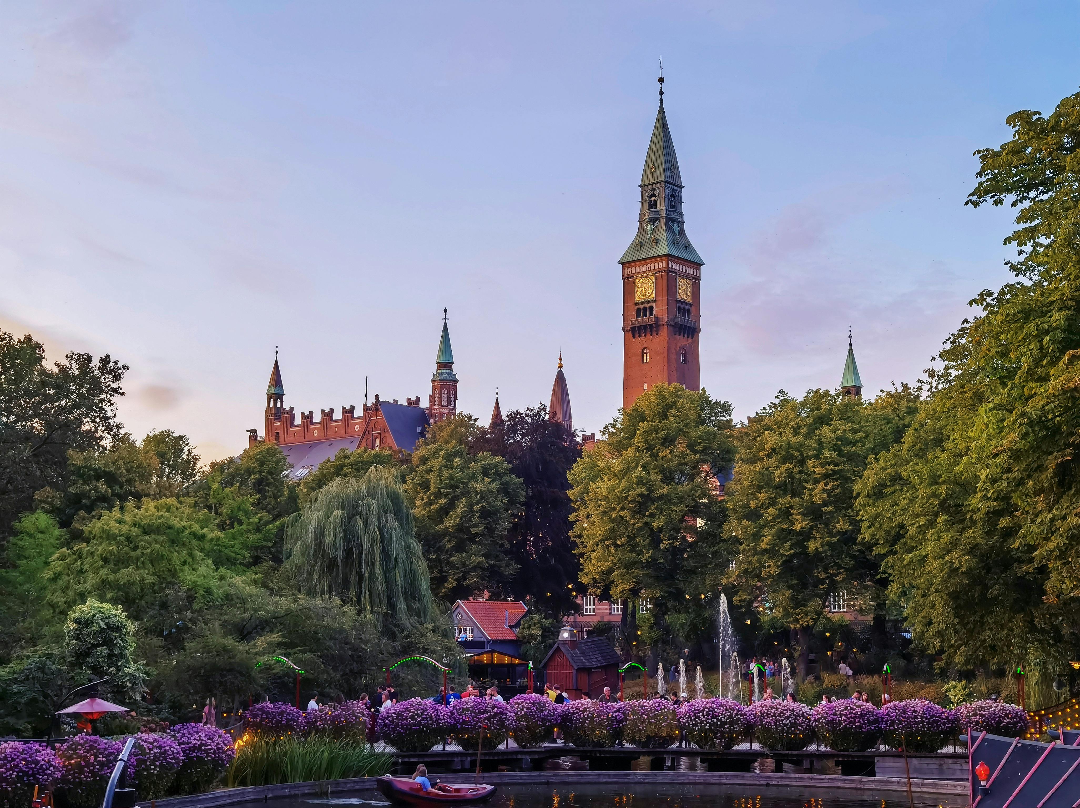 A city with a church tower and a lake · Free Stock Photo