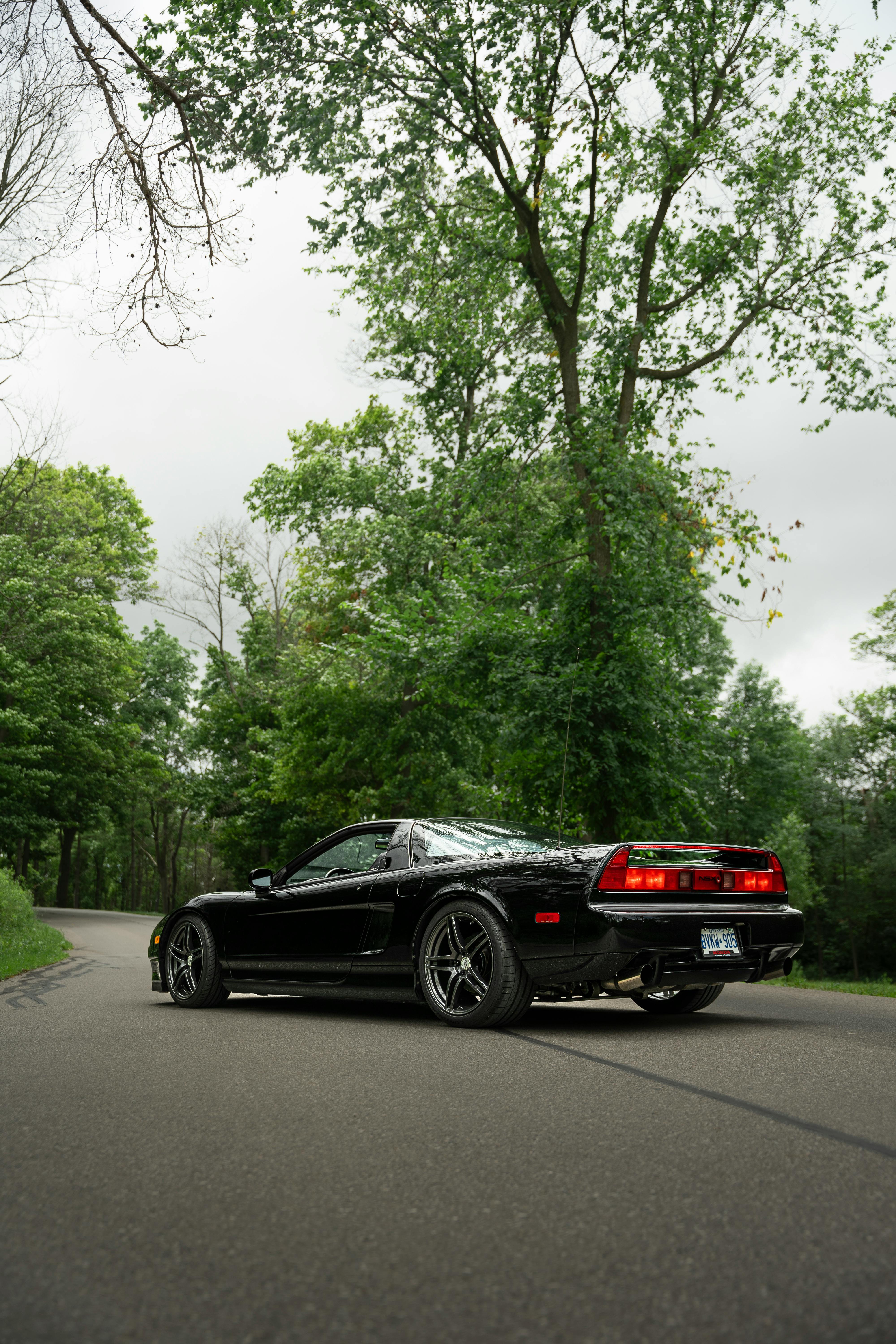 A Black Vintage Honda NSX on a Street · Free Stock Photo