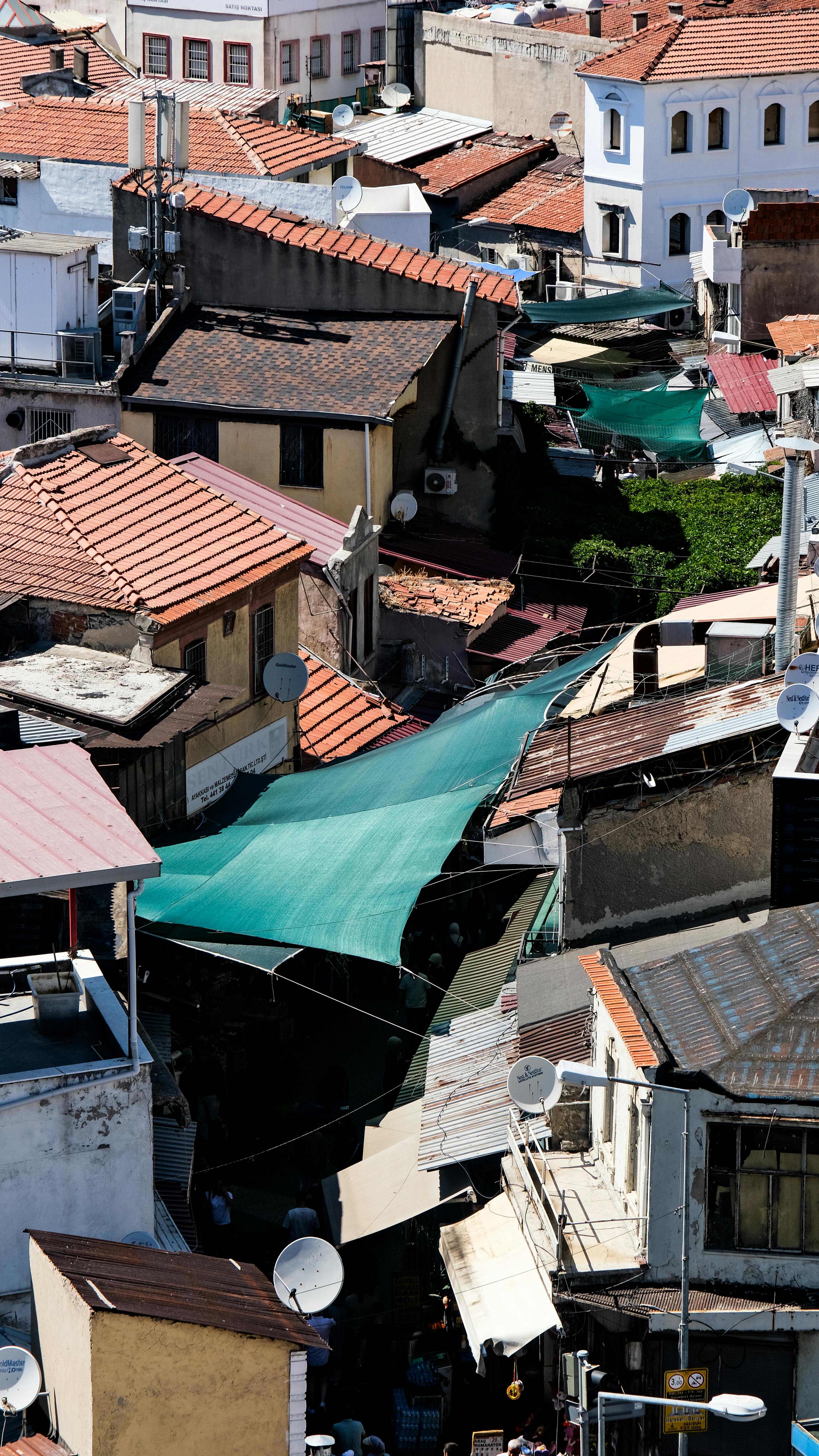 A view of a city with many roofs and buildings · Free Stock Photo