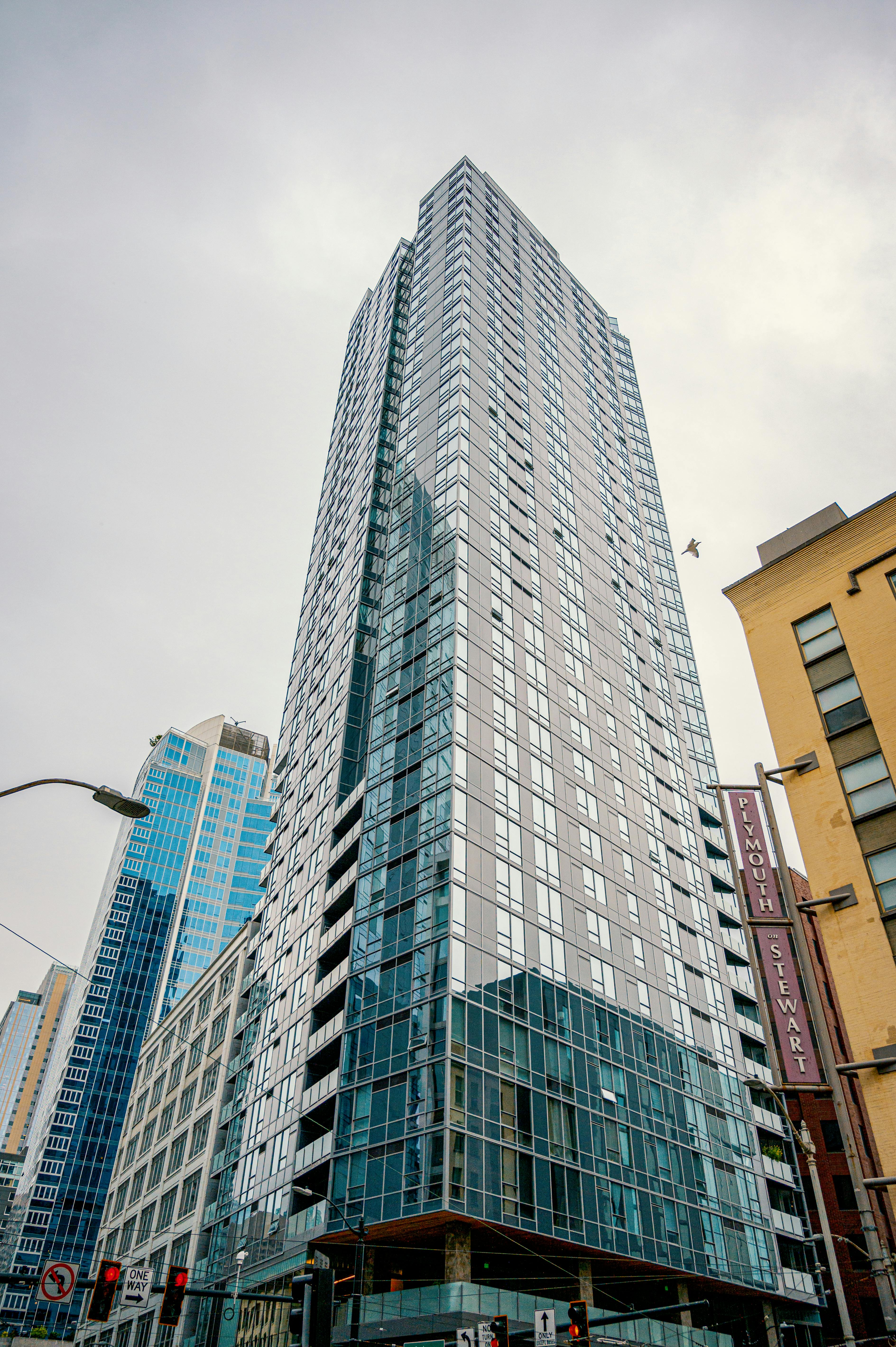 Exterior of a Tall Glass Office Building · Free Stock Photo