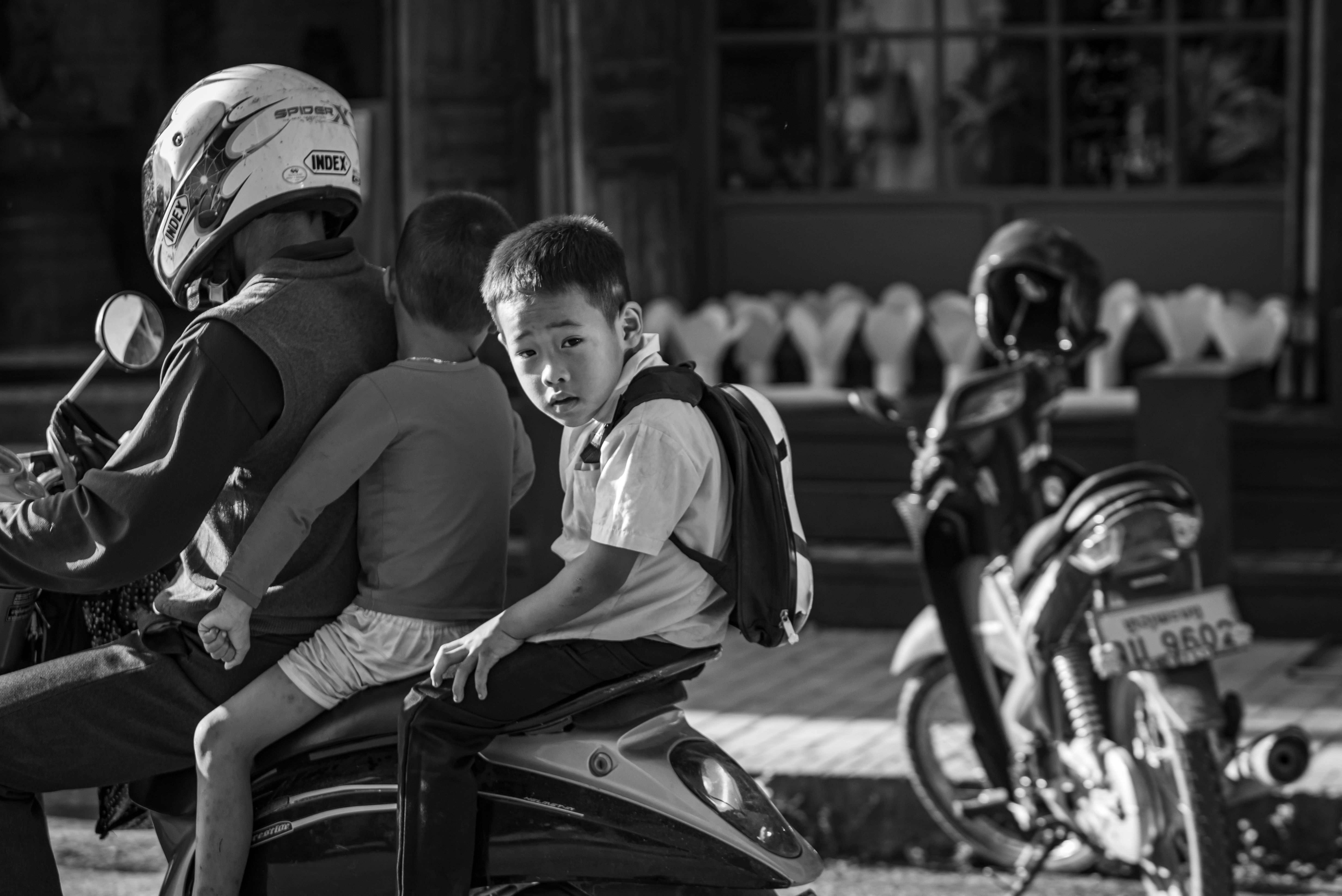 A Man and Two Little Boys Riding a Motor Scooter · Free Stock Photo