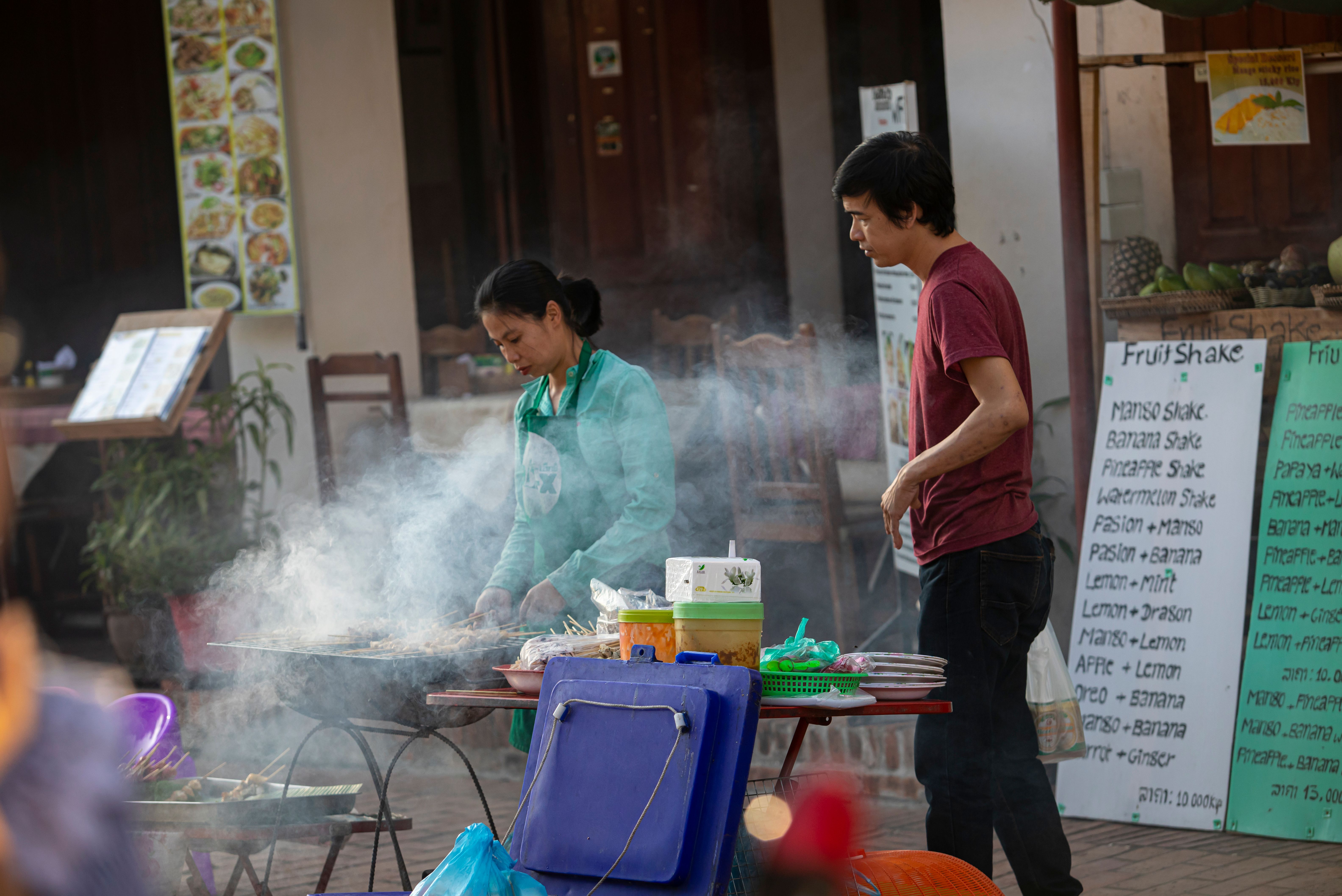 Woman Cooking Food on the Street · Free Stock Photo