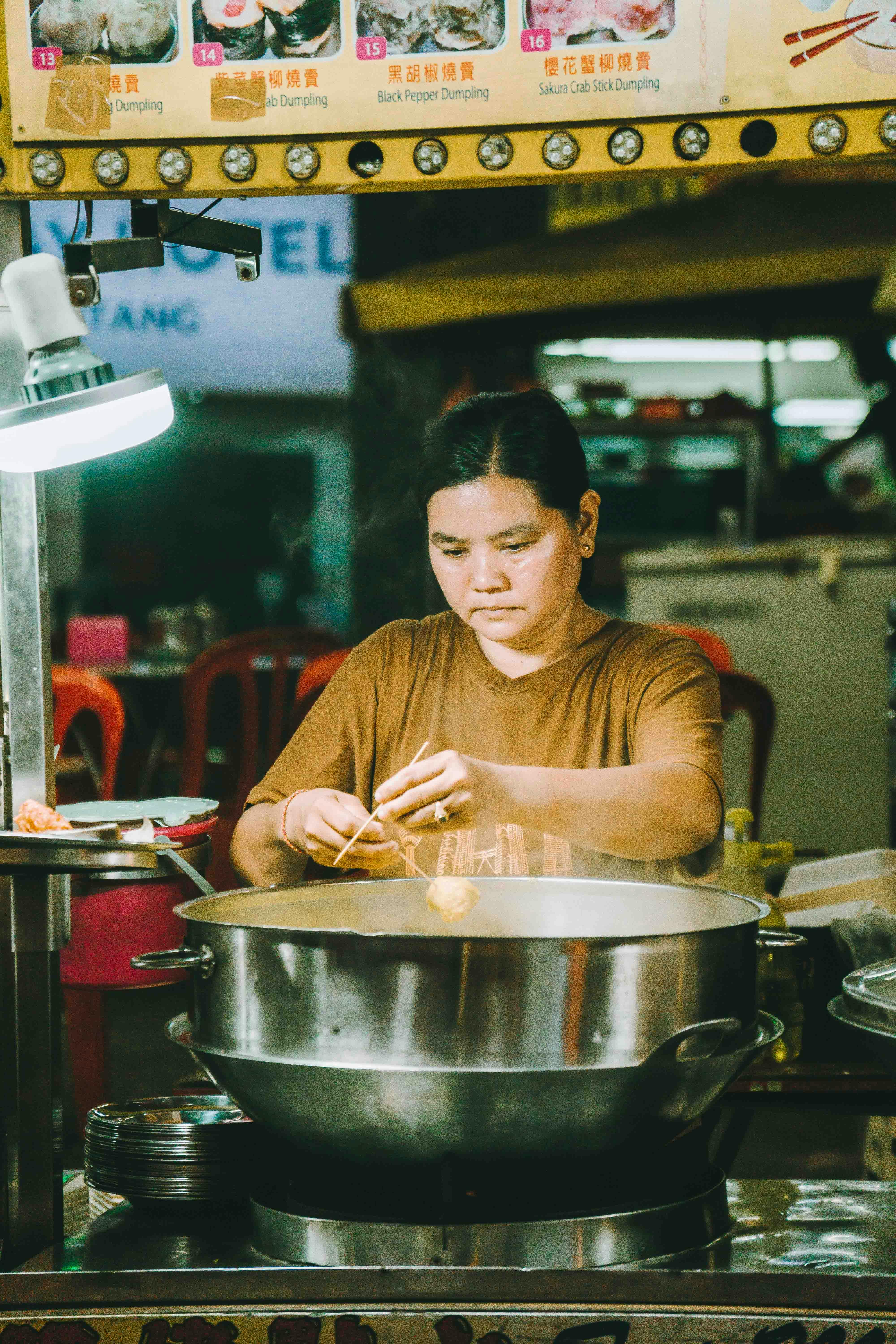 Woman Cooking in a Large Pot · Free Stock Photo