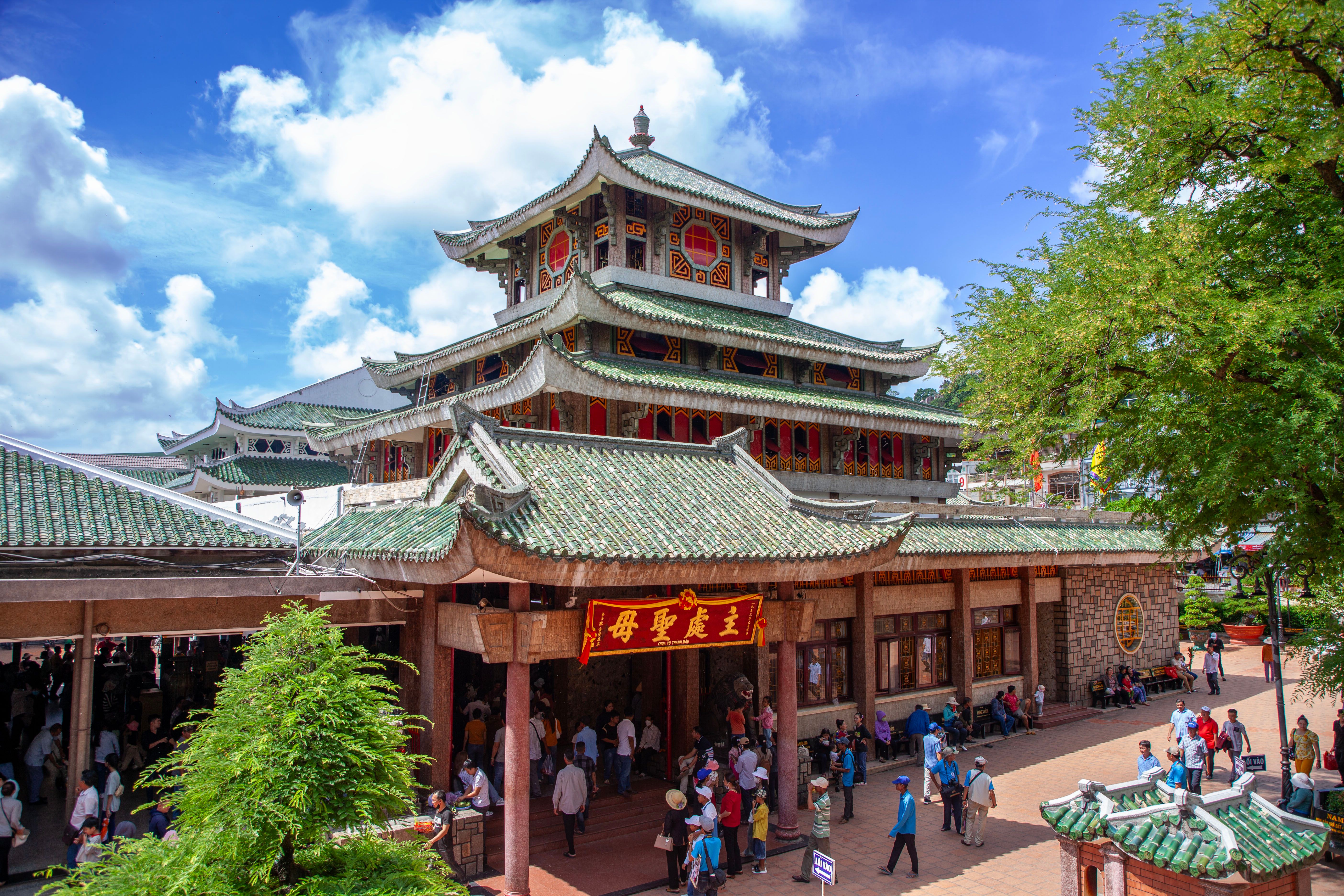 A large asian building with many people walking around it · Free Stock ...