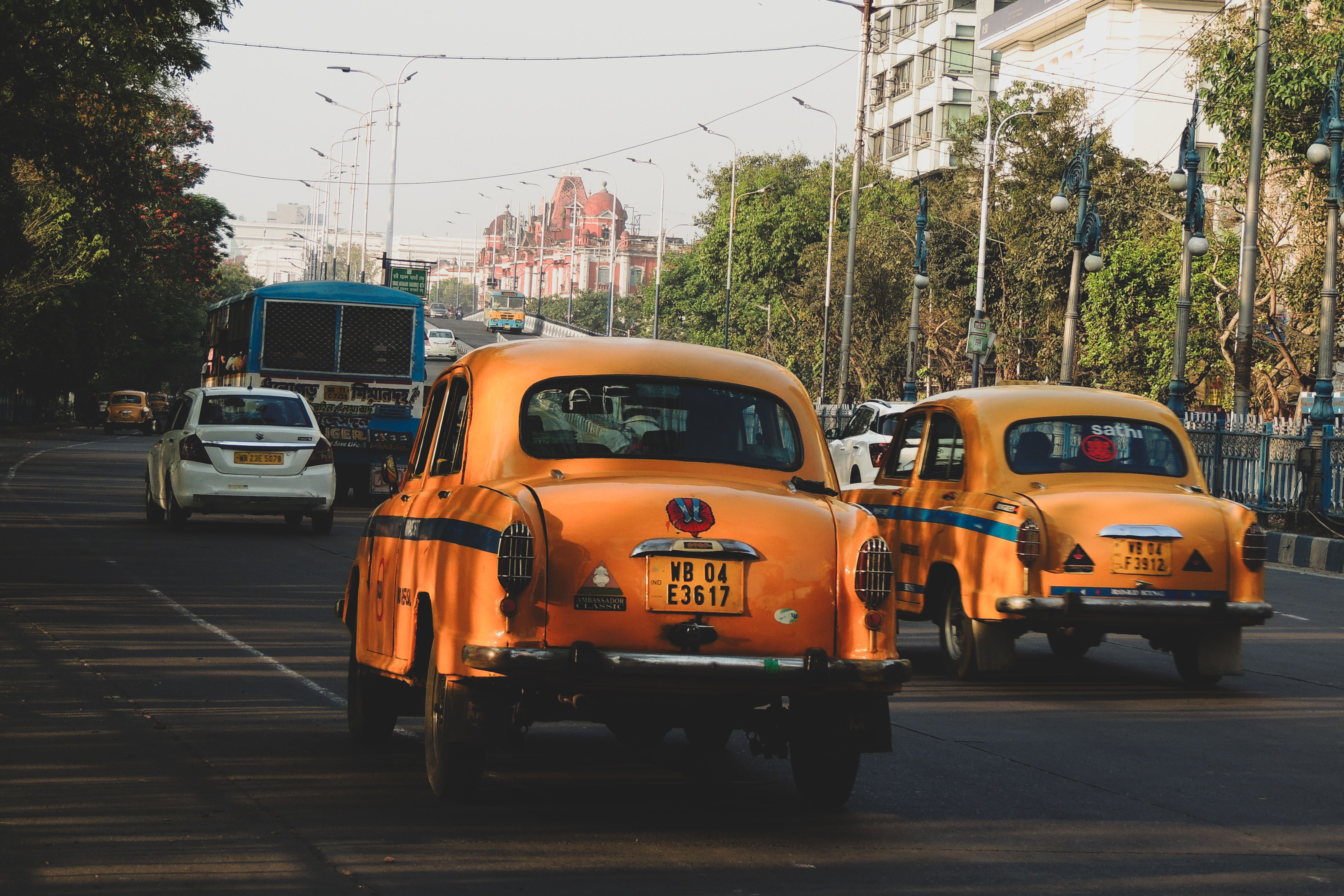 Back View of Vintage Taxis on Street in India · Free Stock Photo
