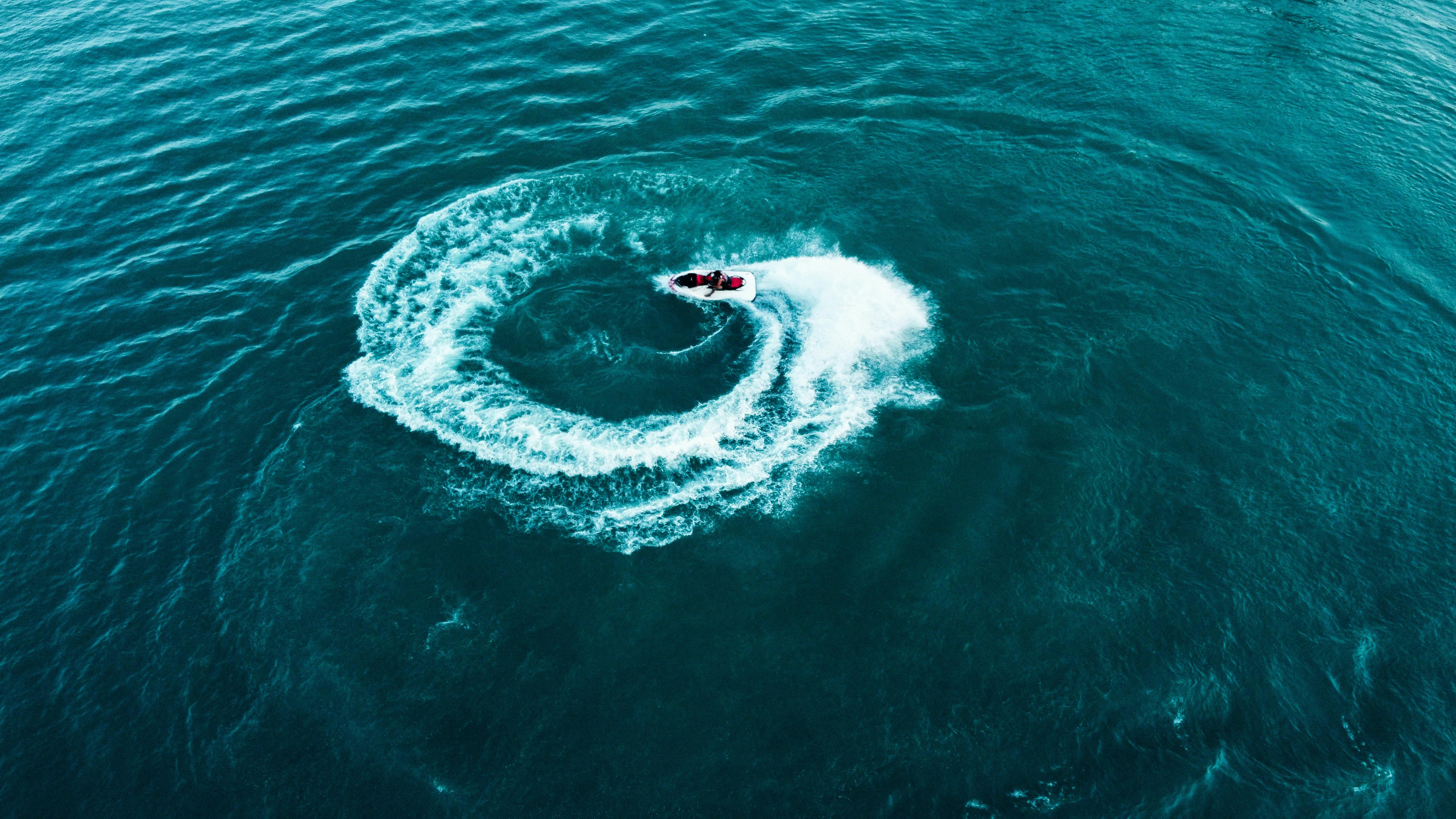 Top View Photo of Boat on Ocean · Free Stock Photo
