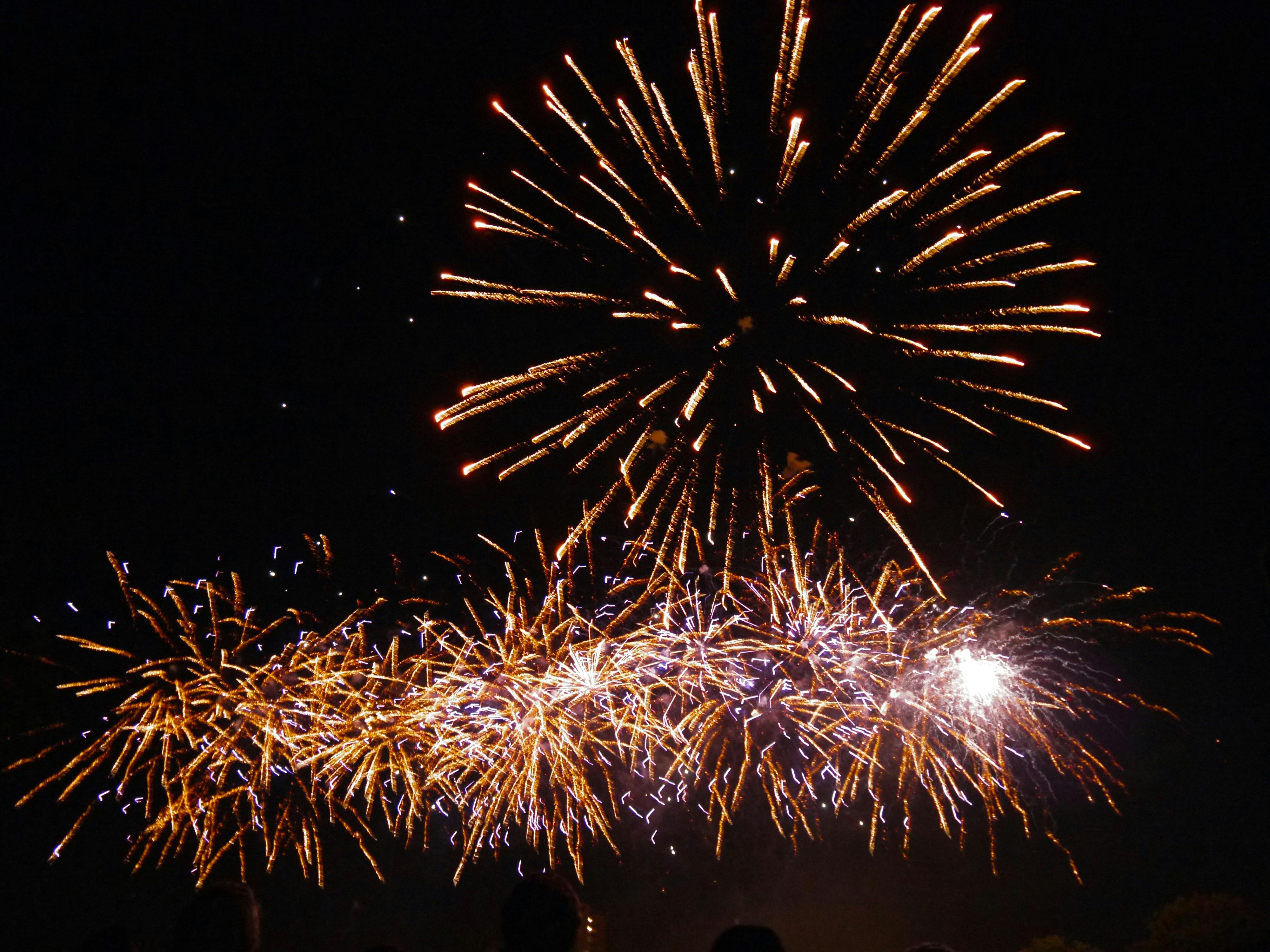 Bright firework with smoke cloud in dark sky at night · Free Stock Photo