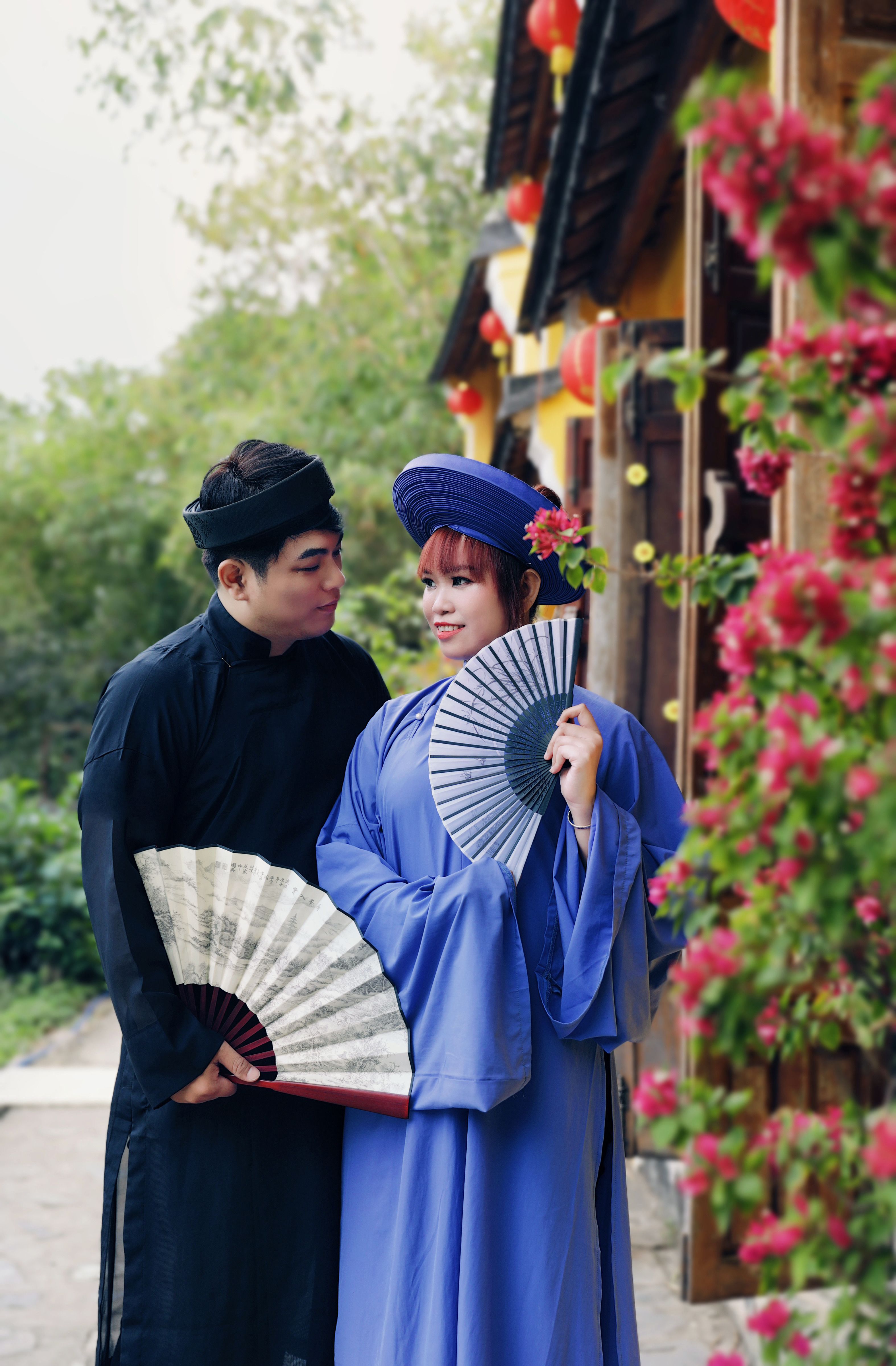 Man and Woman Holding Fans · Free Stock Photo