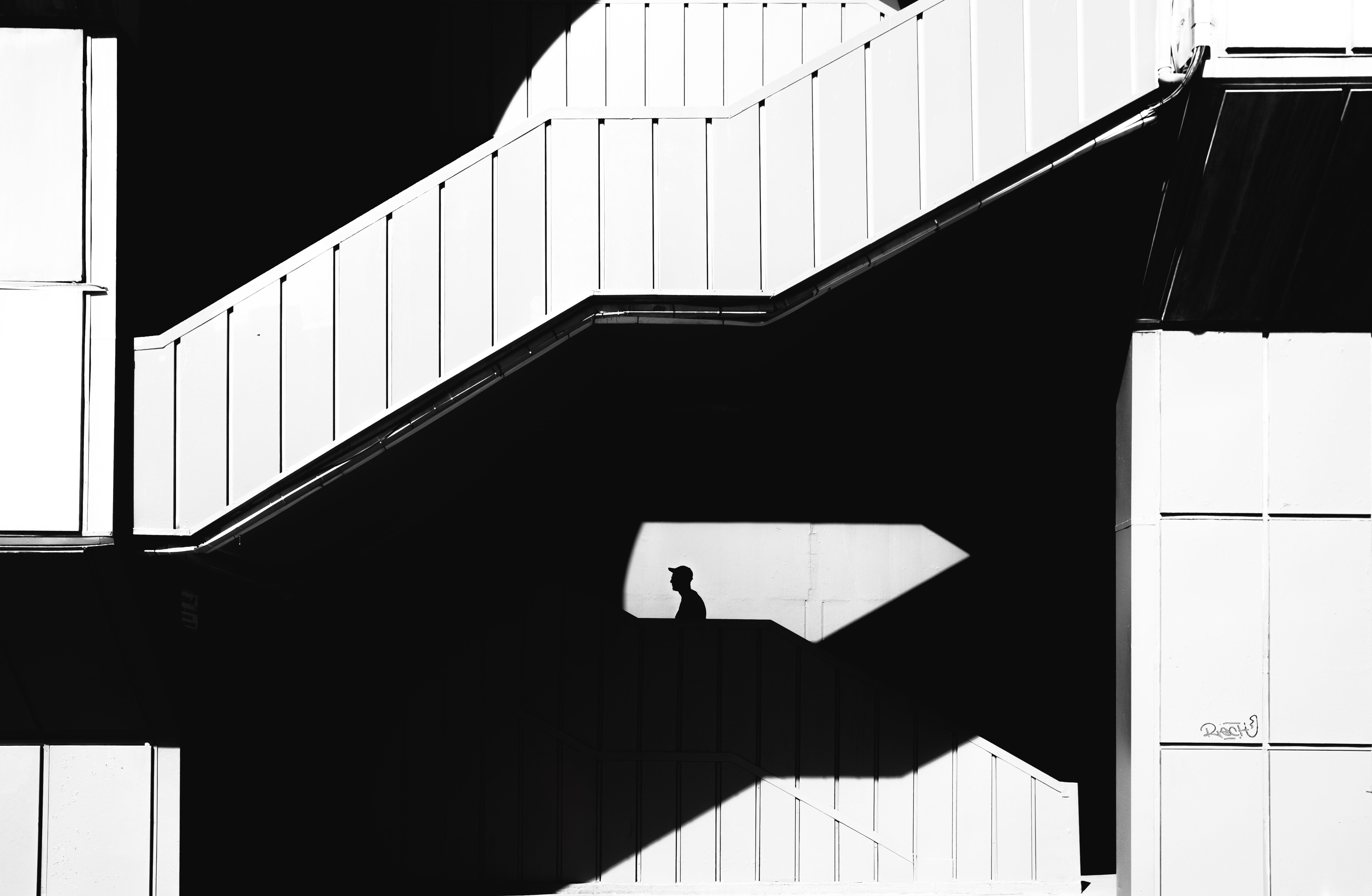 Silhouette of Man behind Wall on Stairs · Free Stock Photo