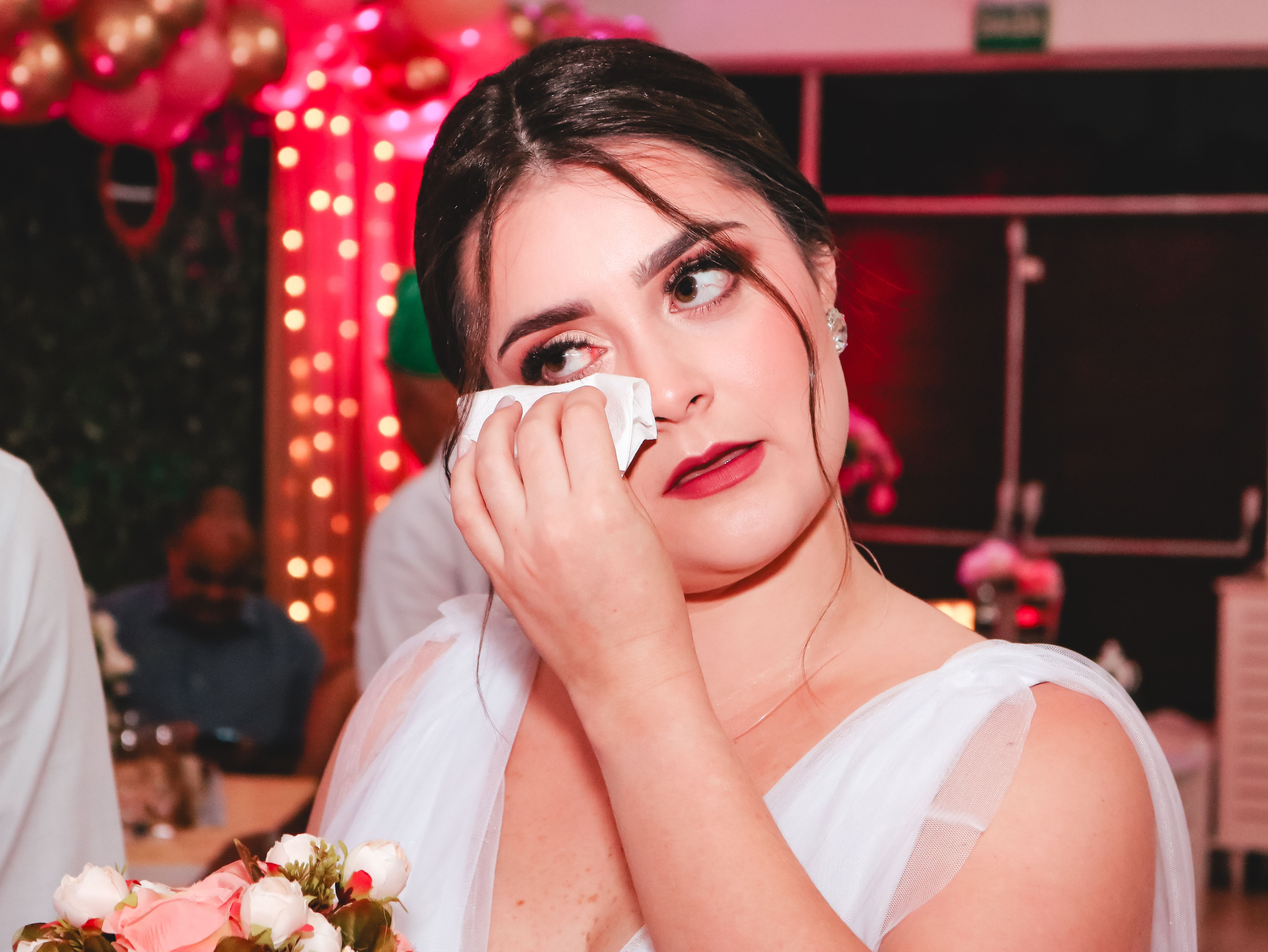 Bride Wiping Tears from her Eye · Free Stock Photo