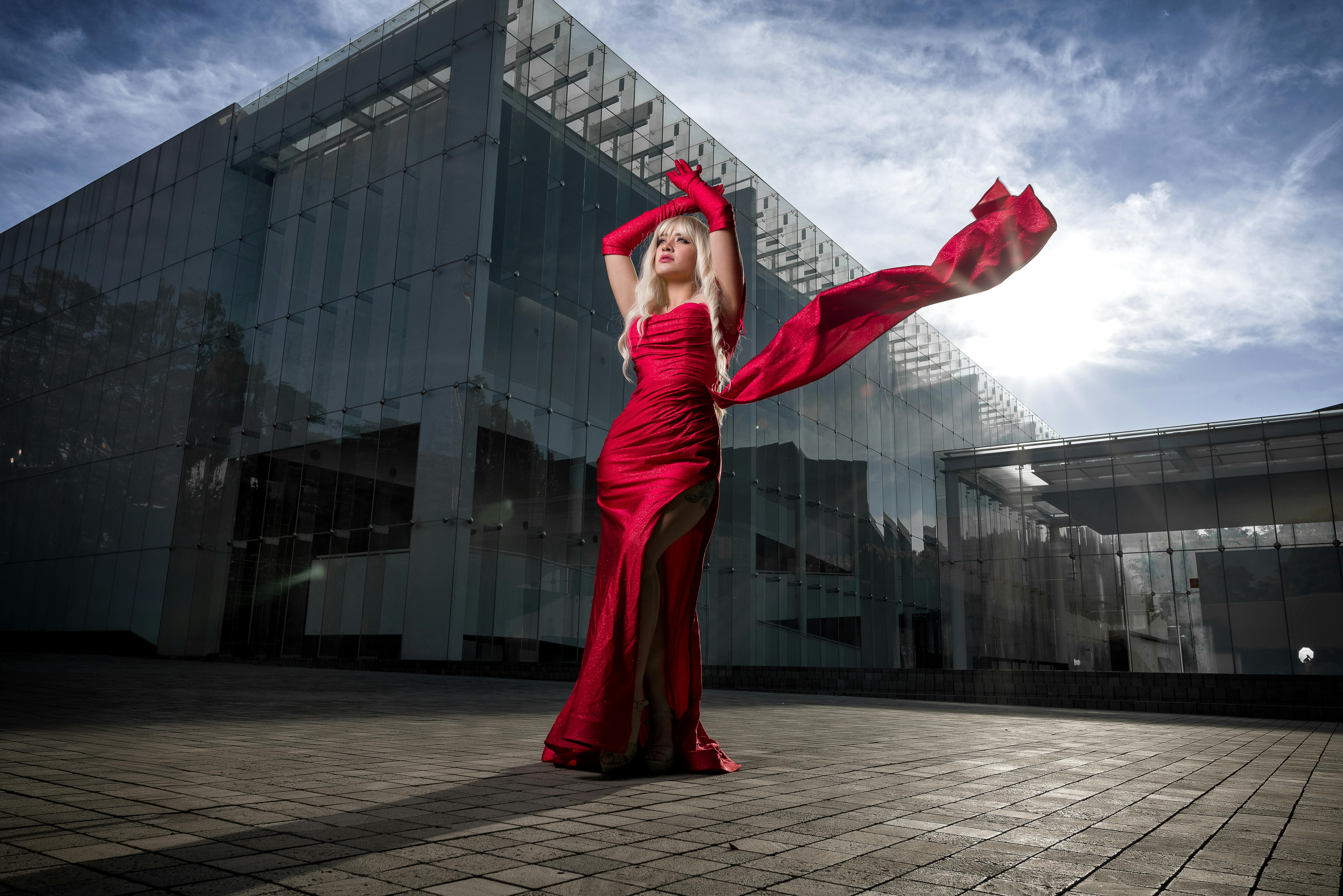 Woman in a Red Dress Posing in Front of a Modern Building · Free Stock ...