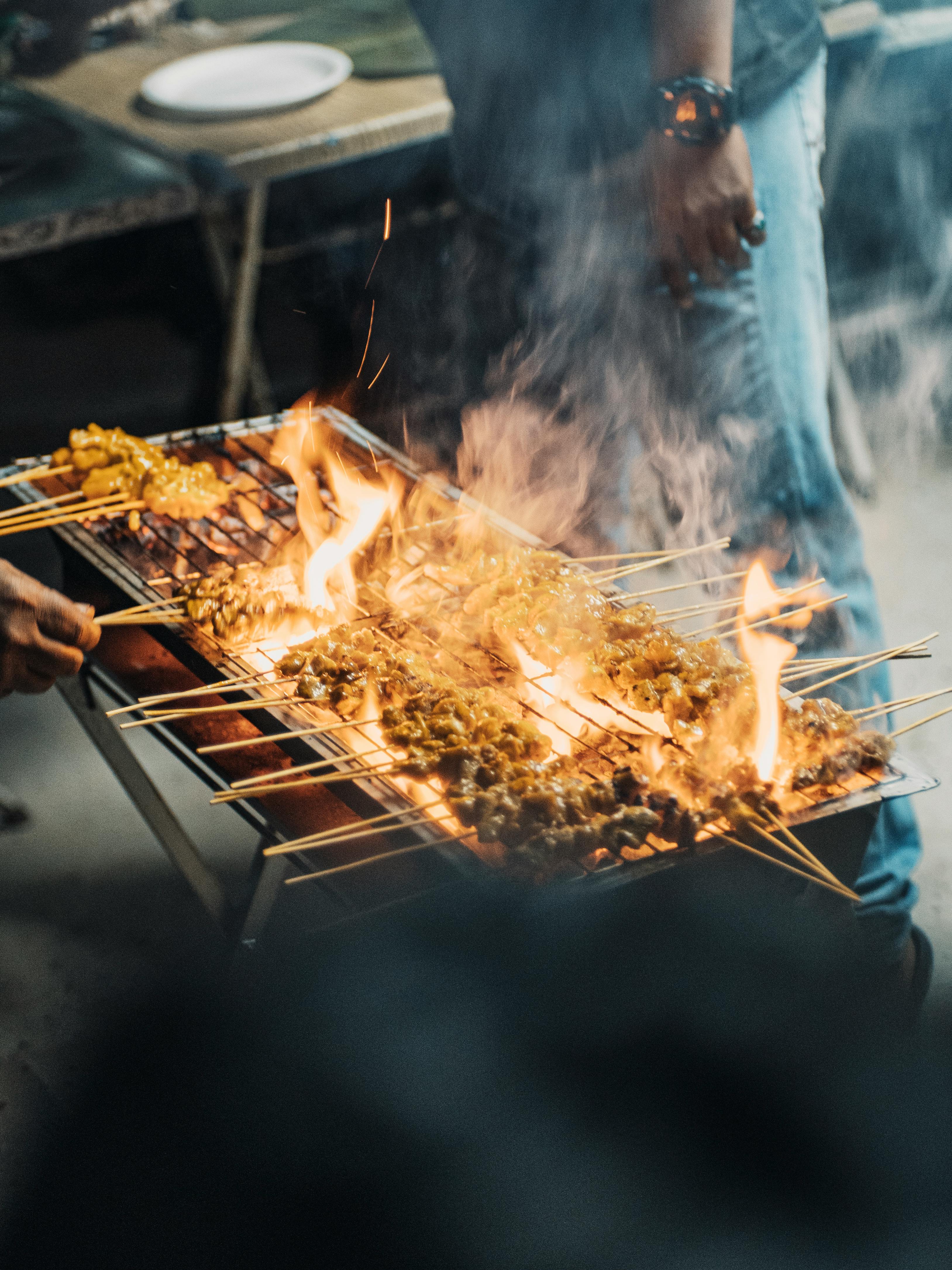People Watching Barbecues Getting Cooked · Free Stock Photo