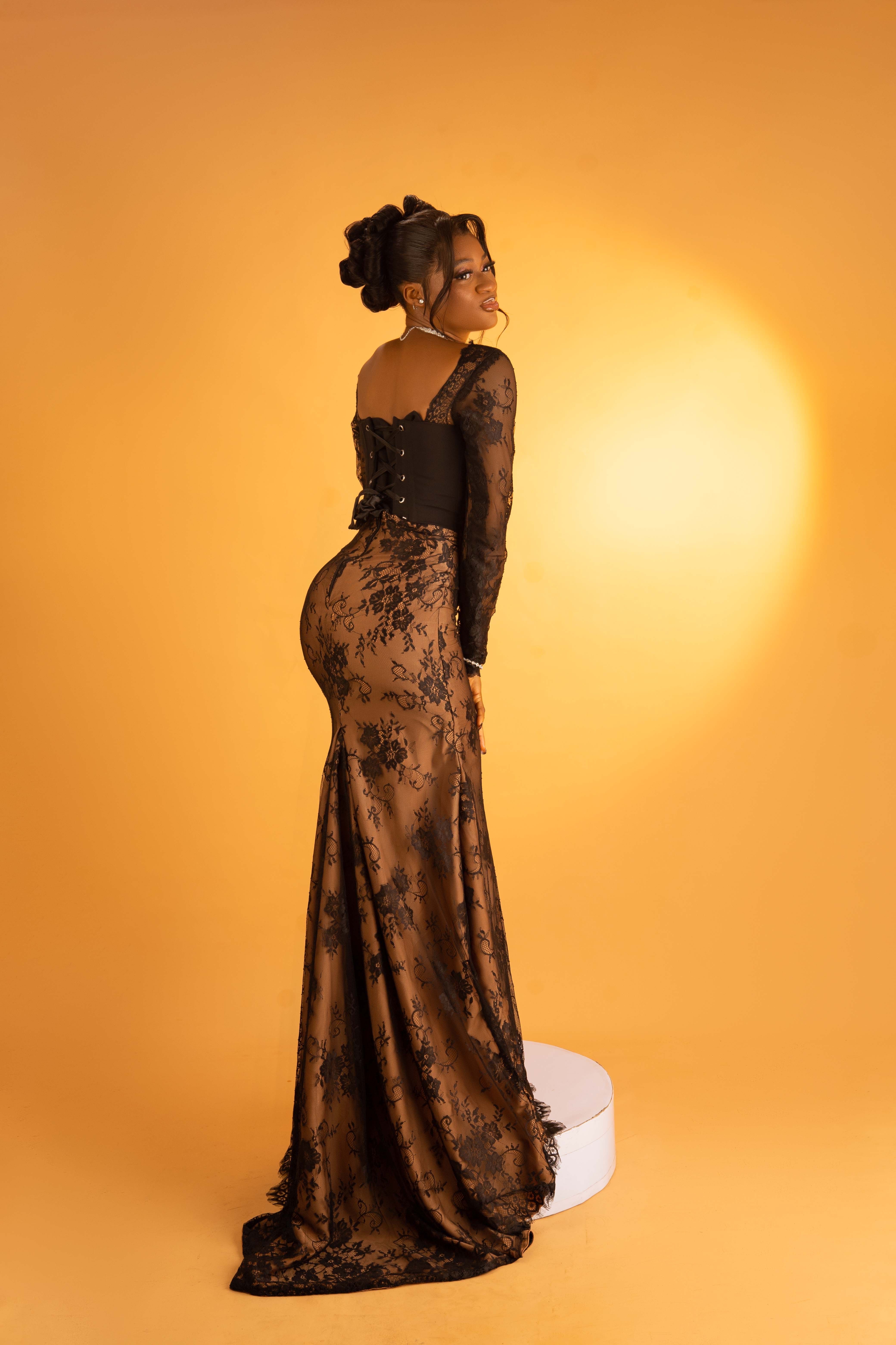 A Woman Posing on a Yellow Background · Free Stock Photo