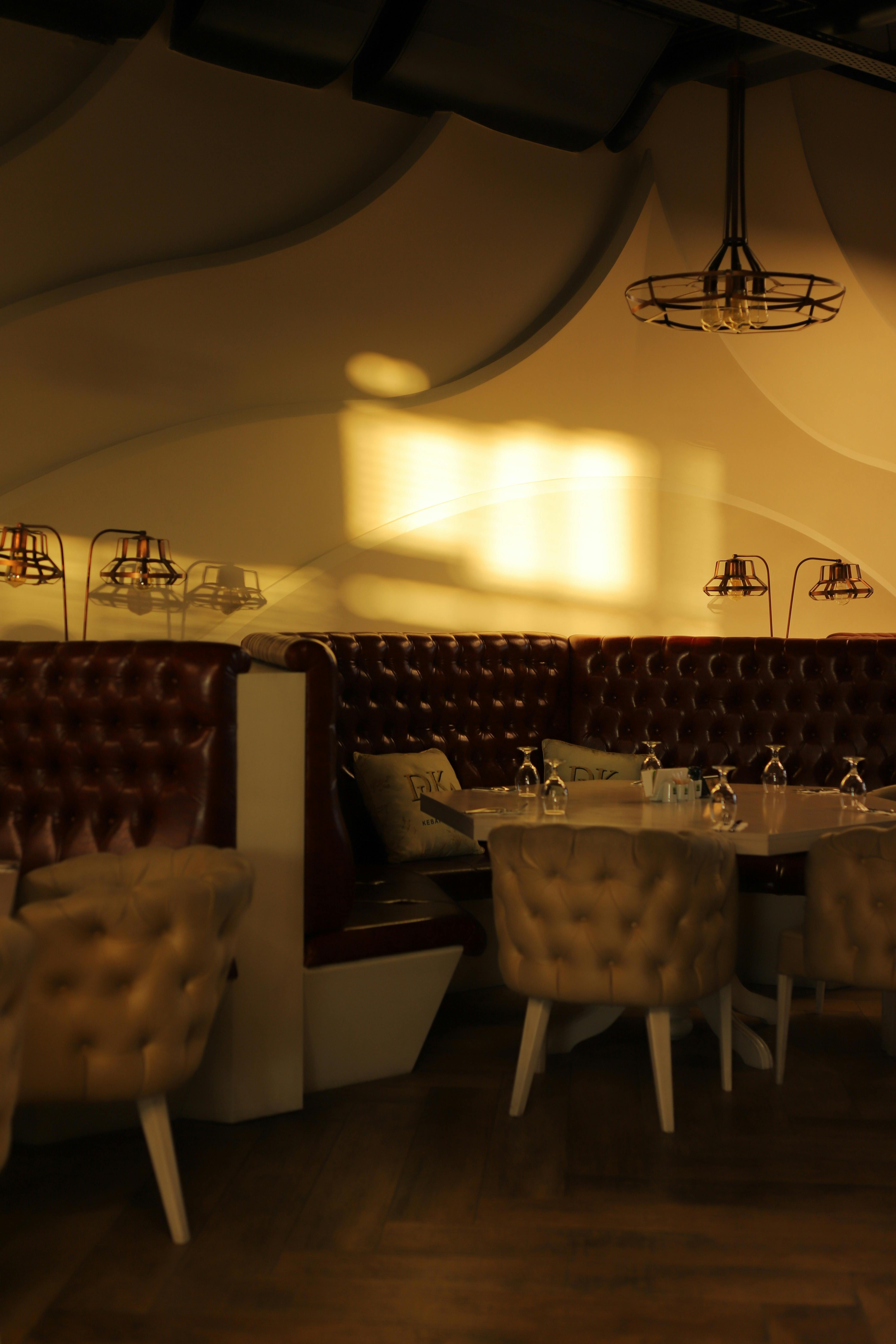 Armchairs in a Restaurant in Shadow · Free Stock Photo
