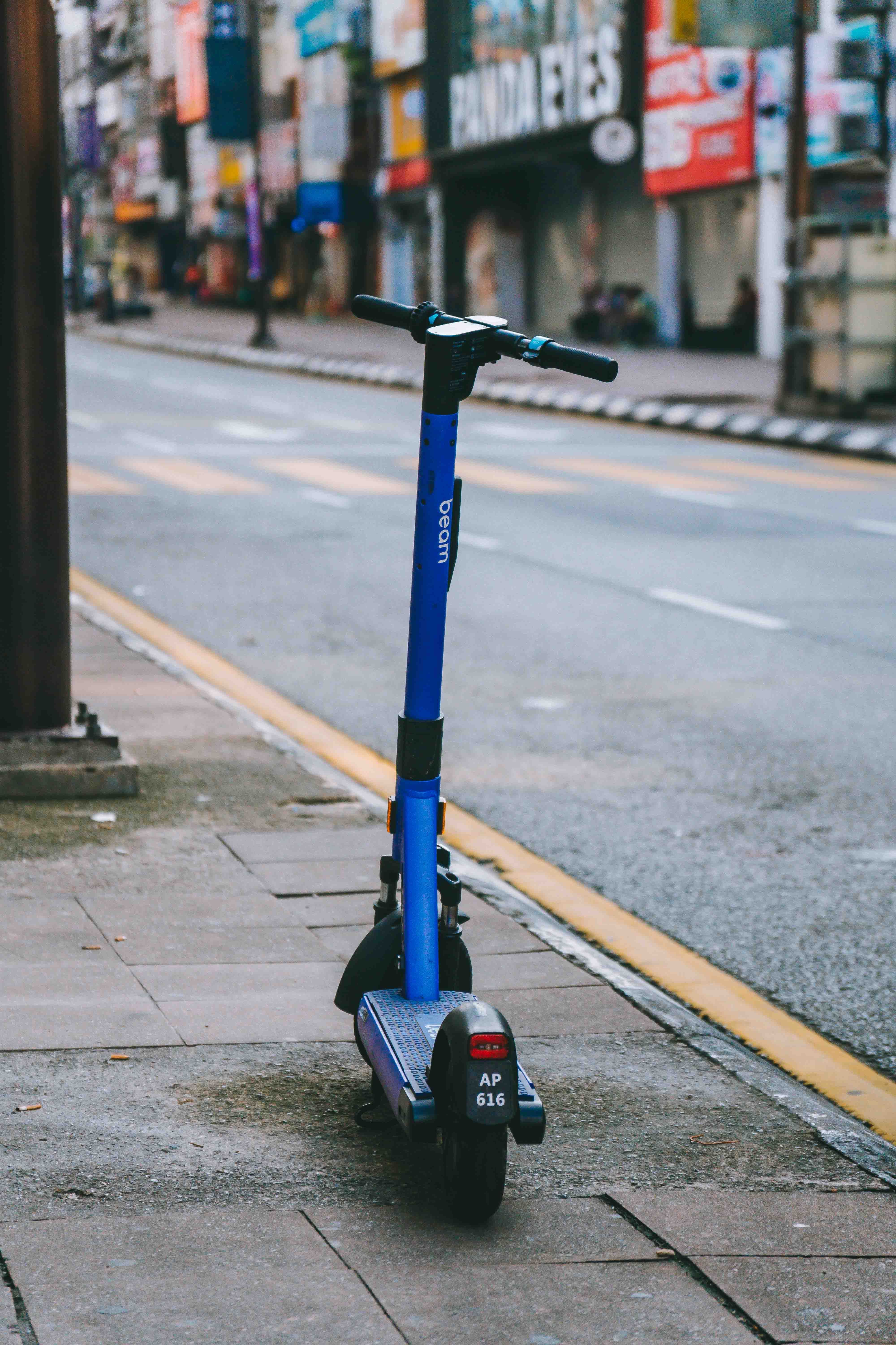 Electric Scooter on Sidewalk · Free Stock Photo