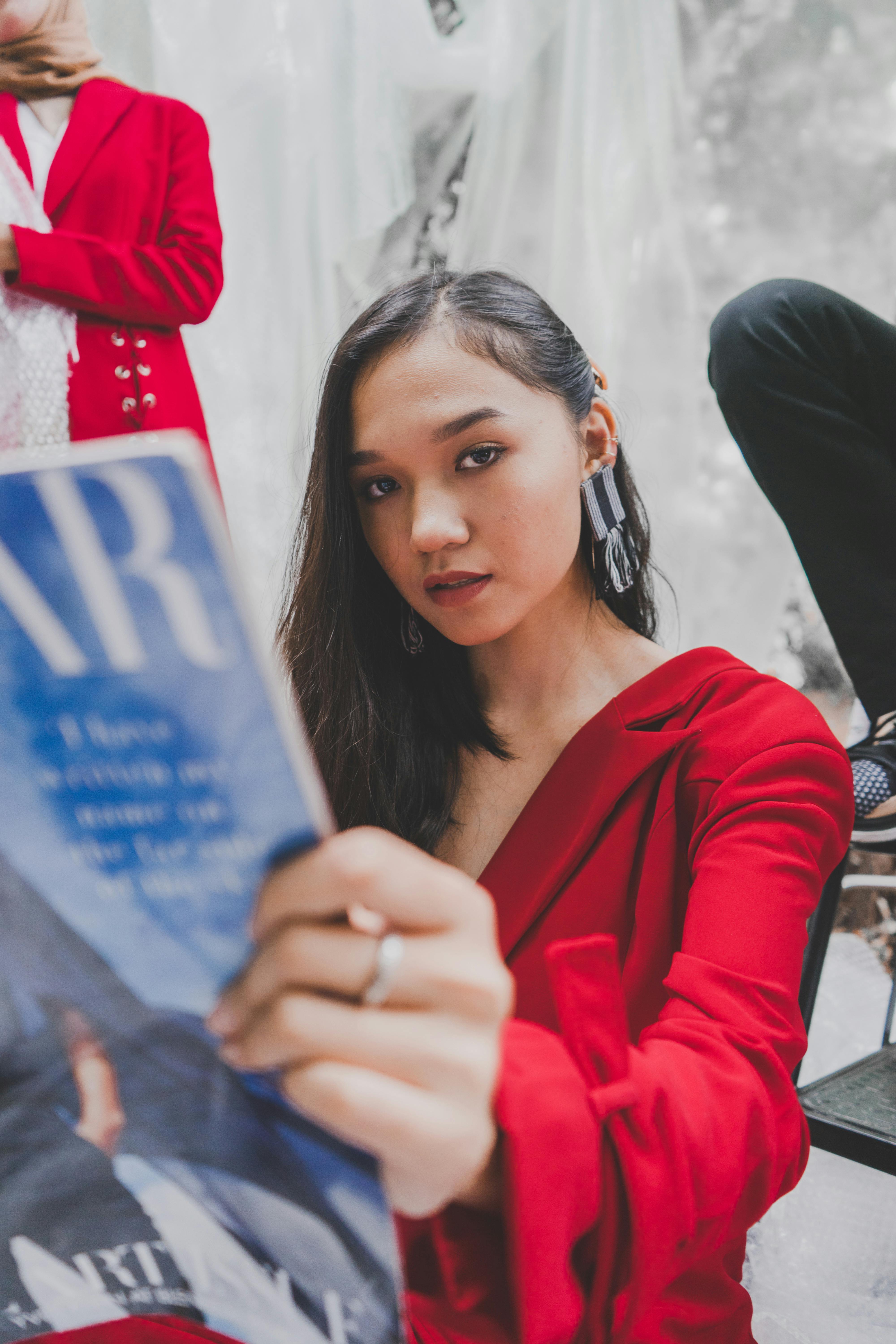 Woman Holding Magazine · Free Stock Photo