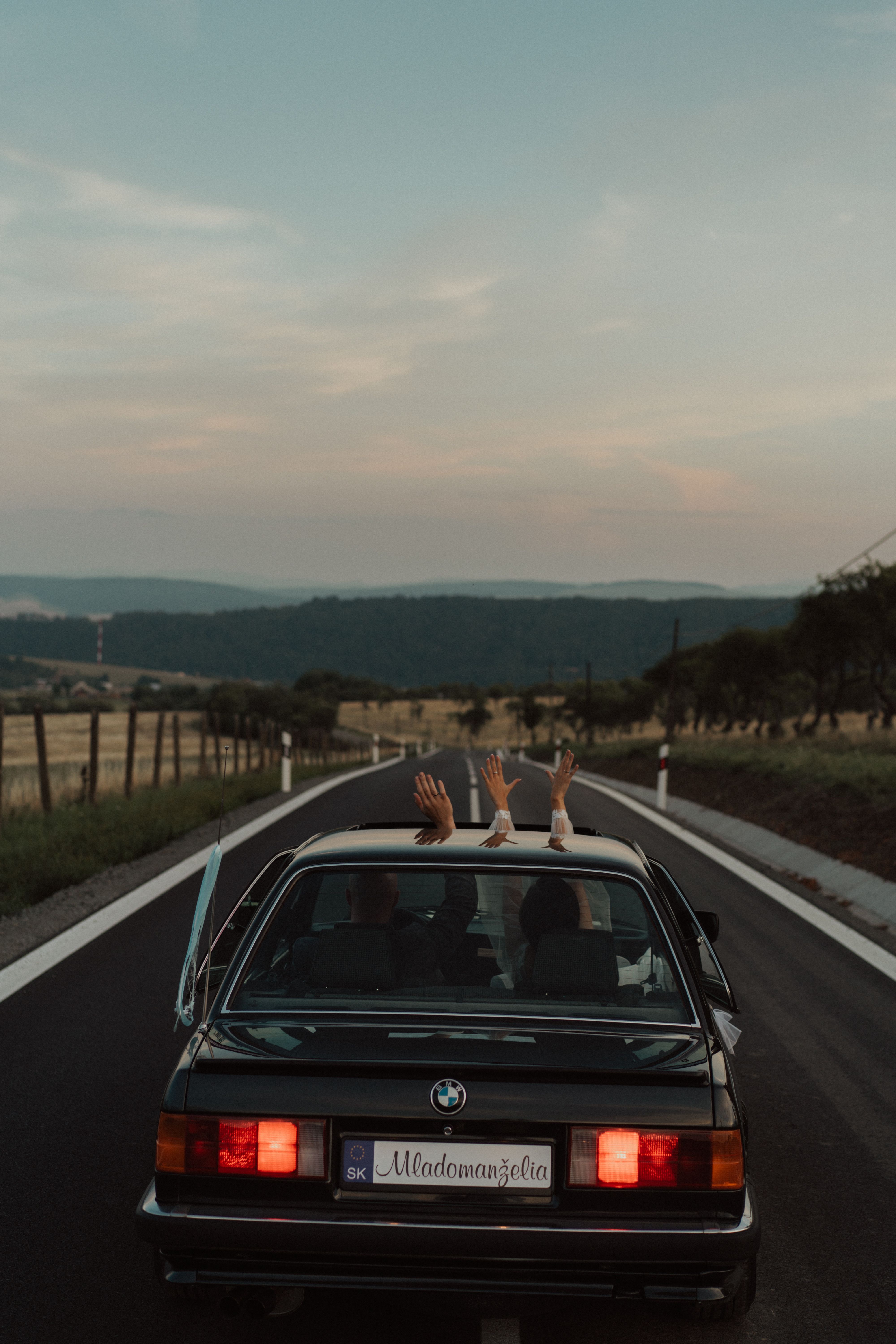 A Black BMW E30 Driving on the Street · Free Stock Photo