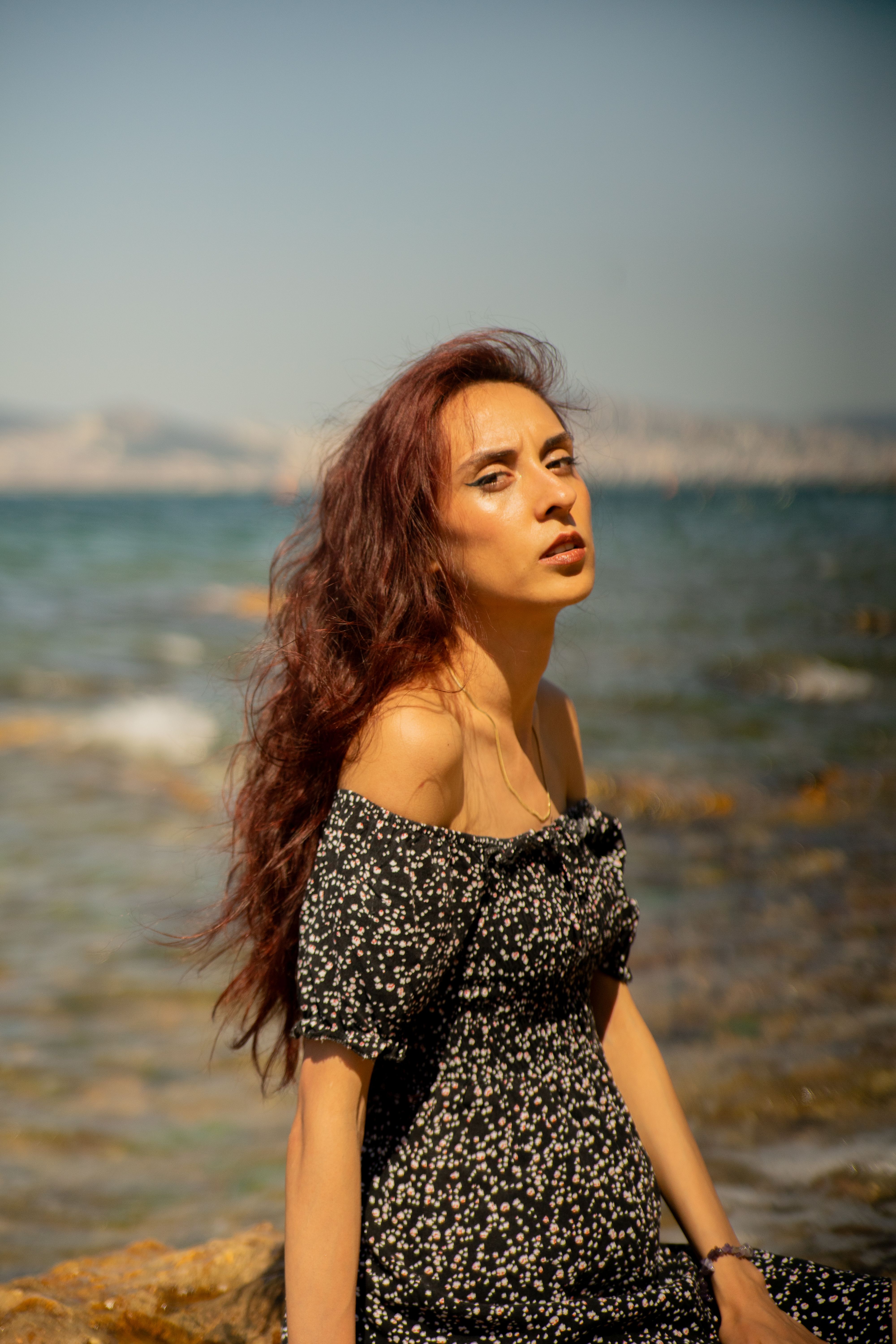 A Woman Undressing on the Beach · Free Stock Photo