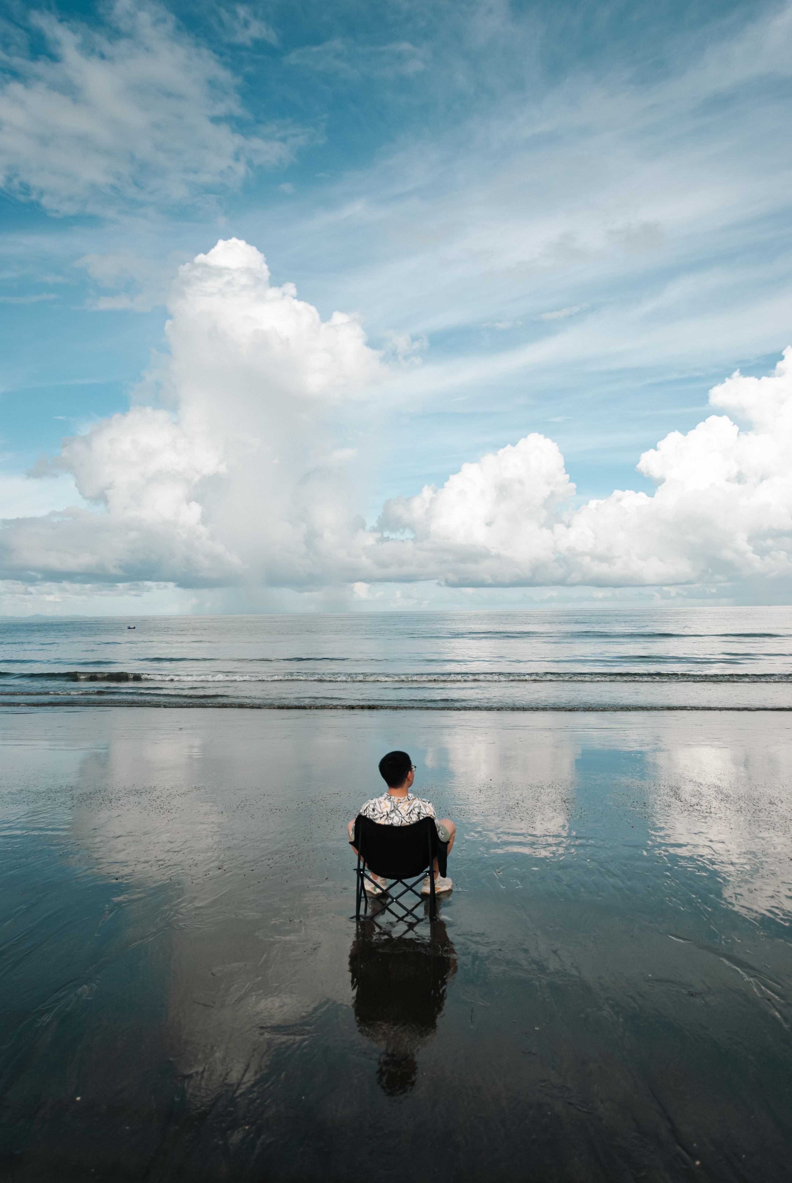 Back View of a Man Sitting on a Lake · Free Stock Photo