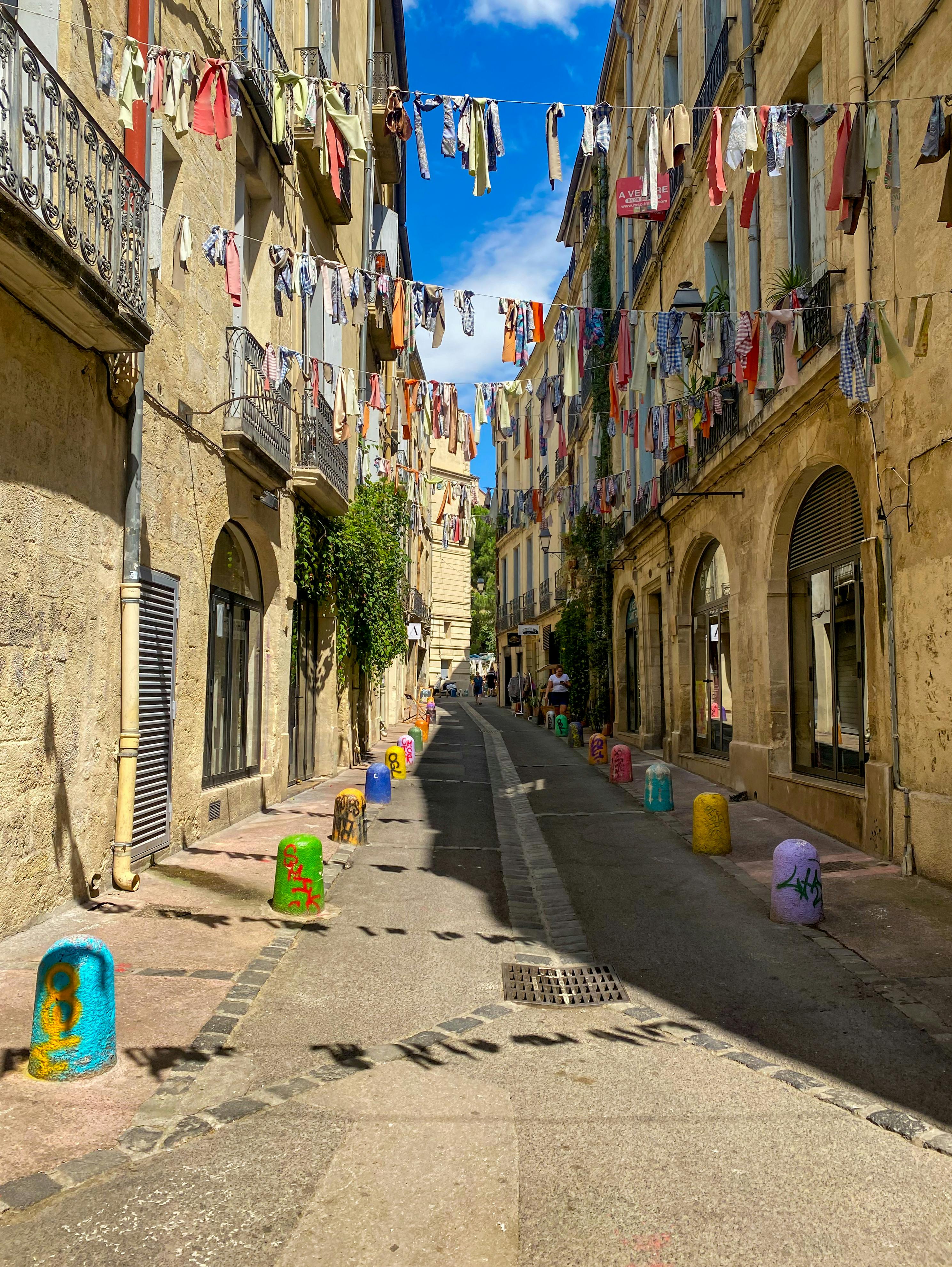 Colorful Posts and Cloths on Street in Town · Free Stock Photo