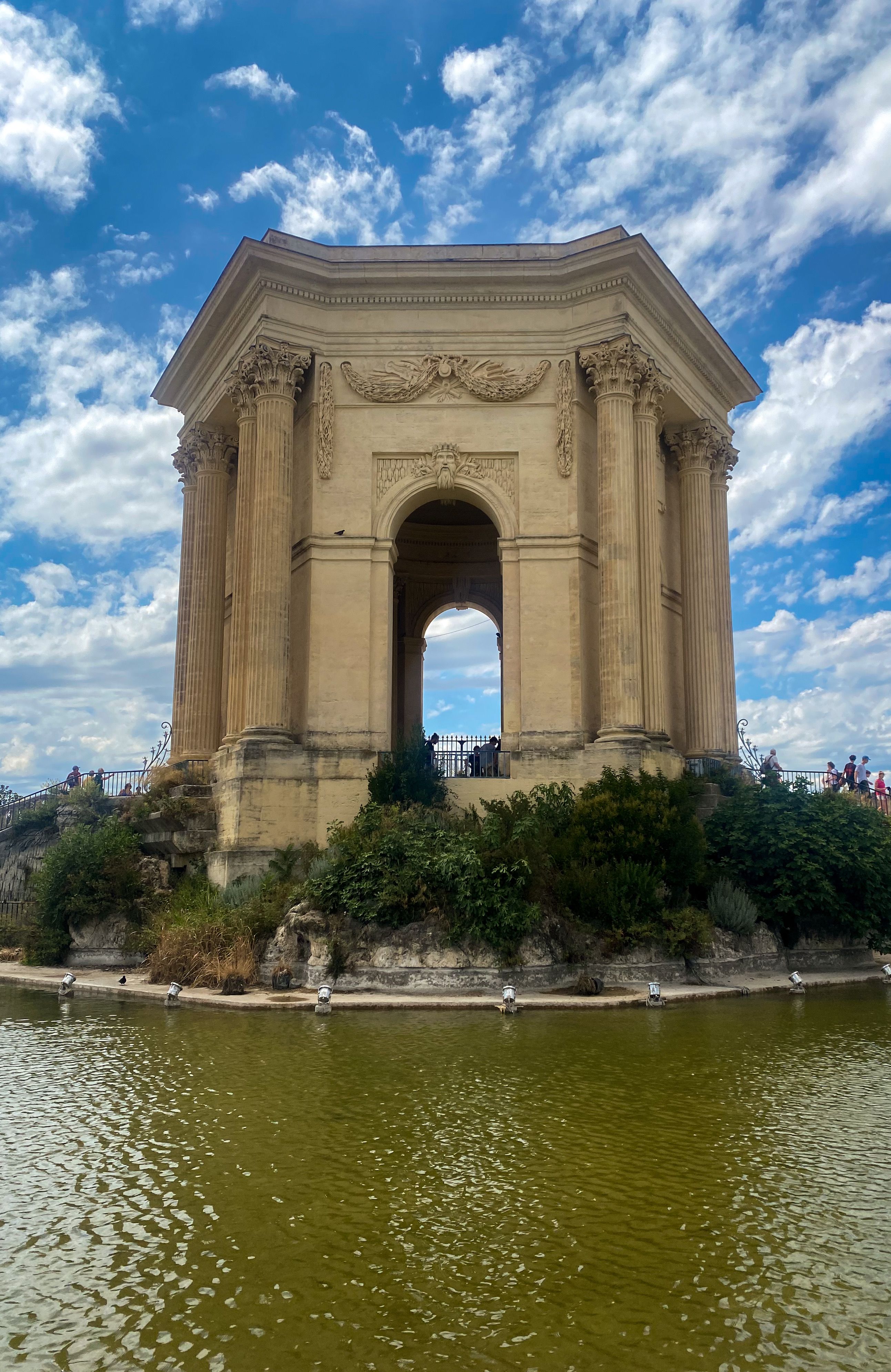 The monument is surrounded by water and clouds · Free Stock Photo