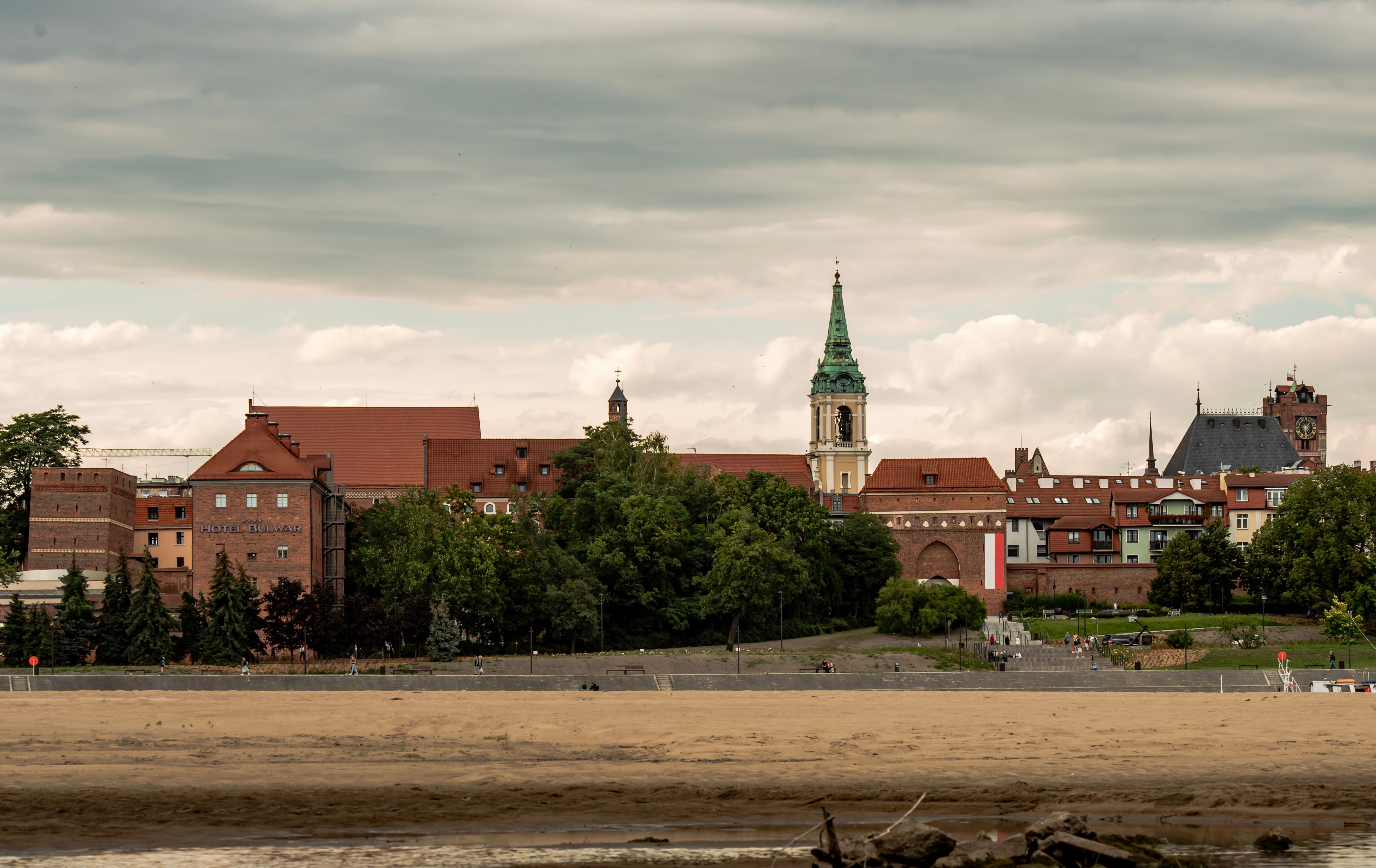 Cityscape of Torun Against a Grey Sky · Free Stock Photo