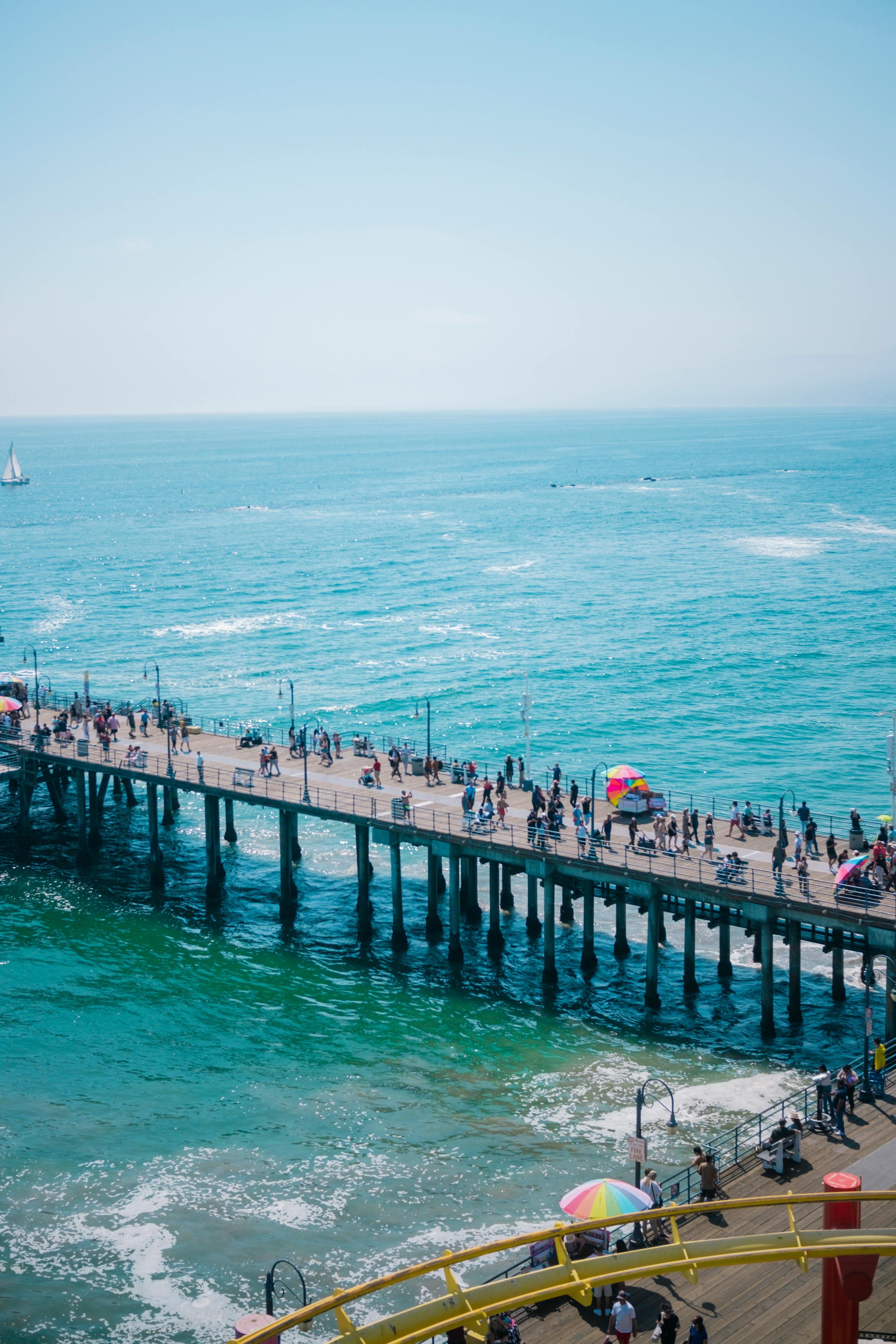 People on Pier on Sea Shore · Free Stock Photo