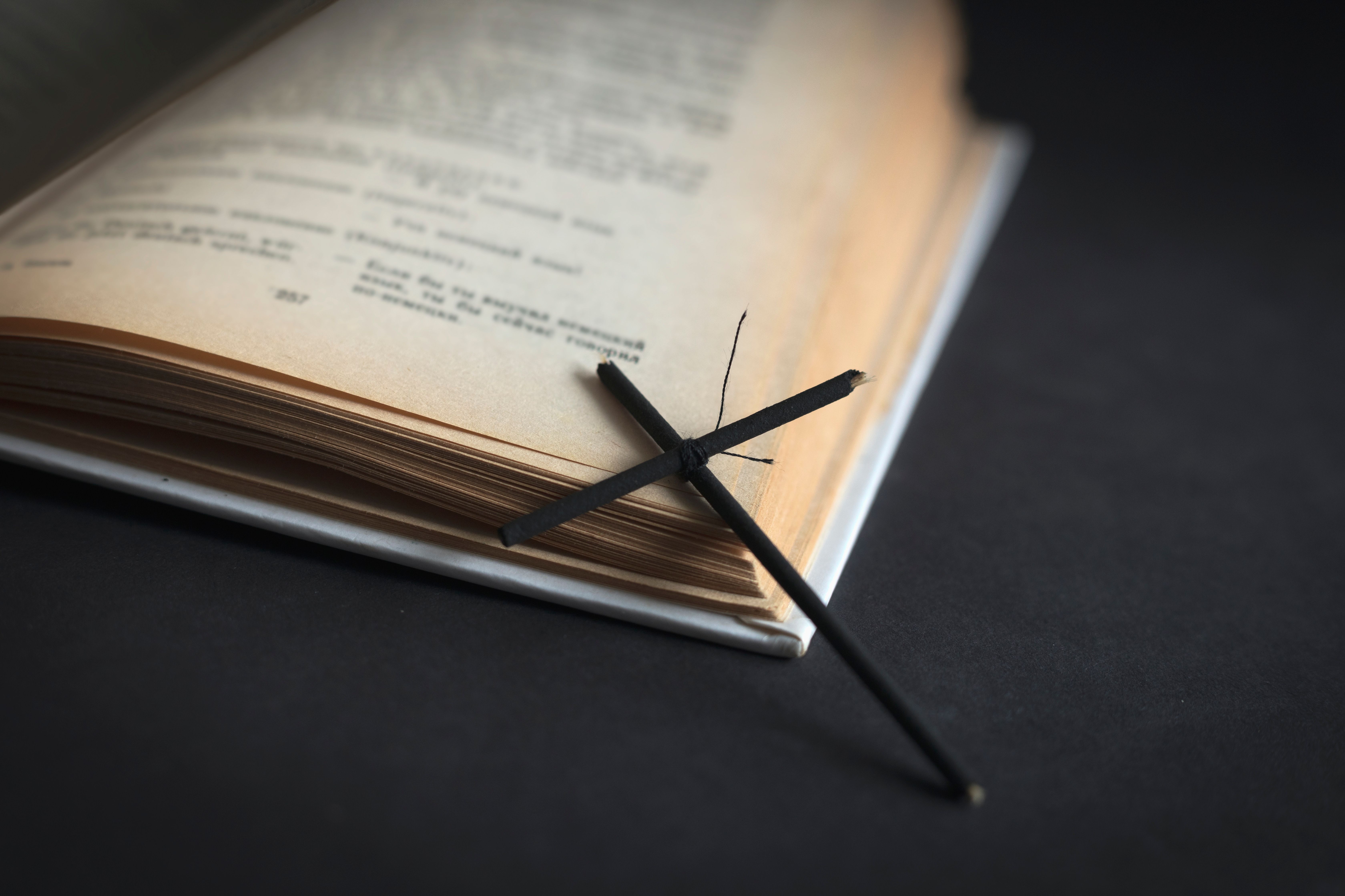 Cross on Book Page · Free Stock Photo