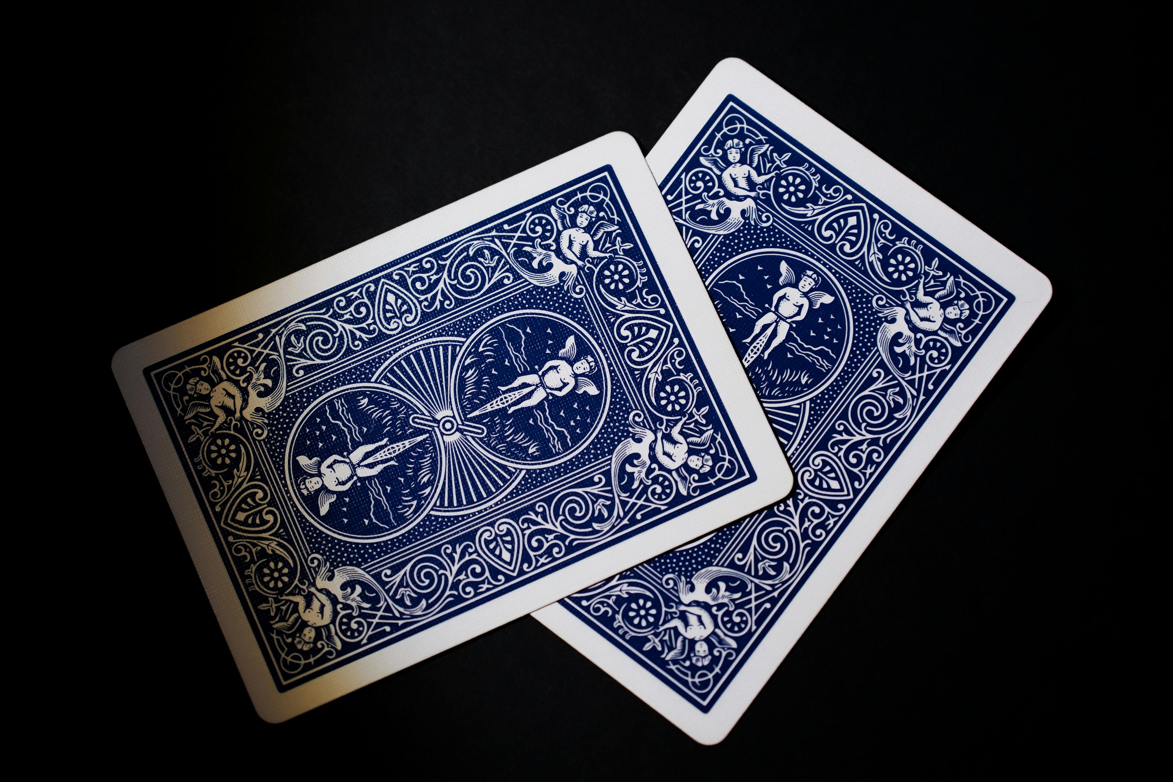 Close-up of Two Playing Cards on Black Background · Free Stock Photo