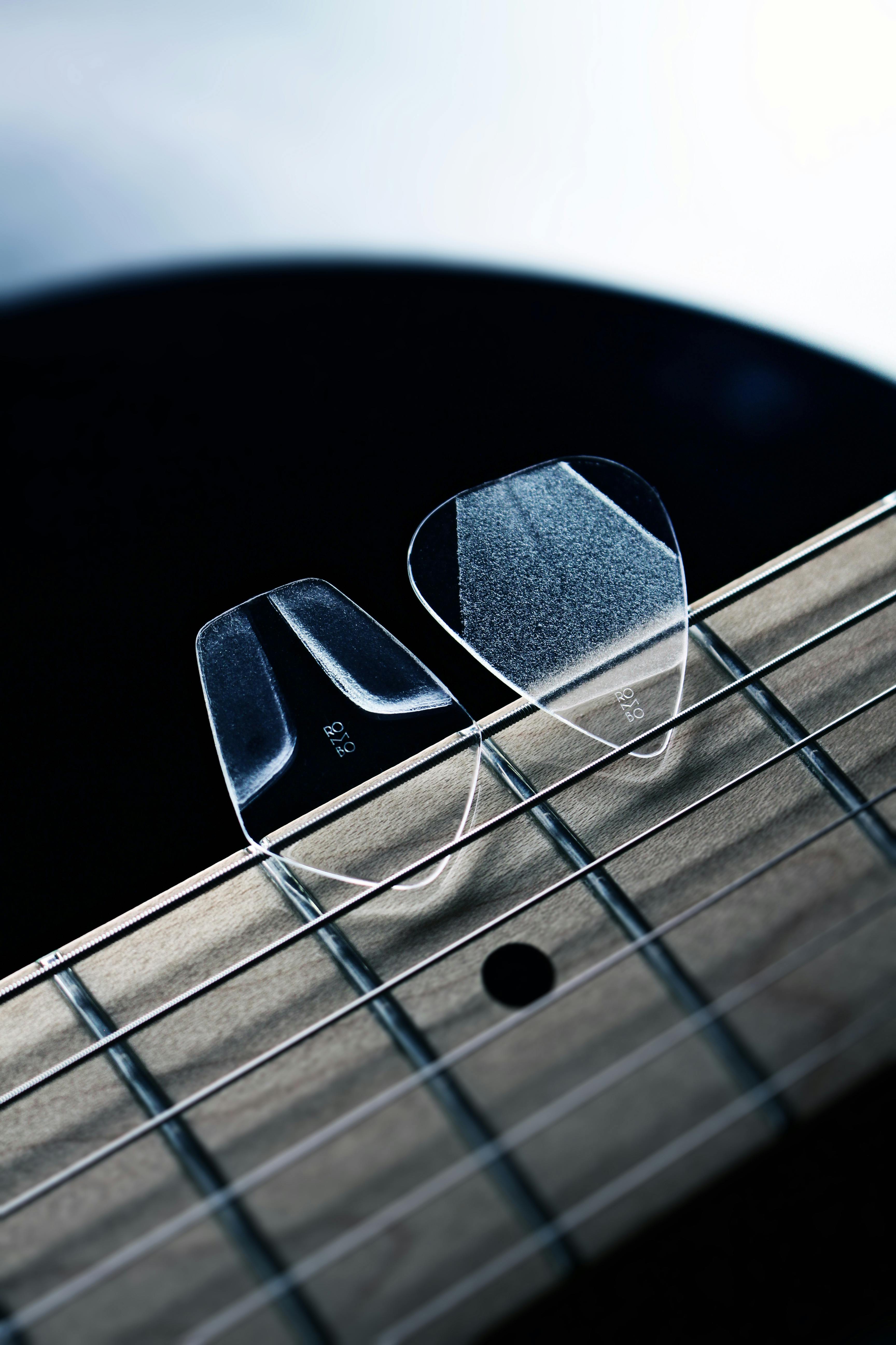 Guitar Pick laying on Fret Board and Guitar Gear · Free Stock Photo