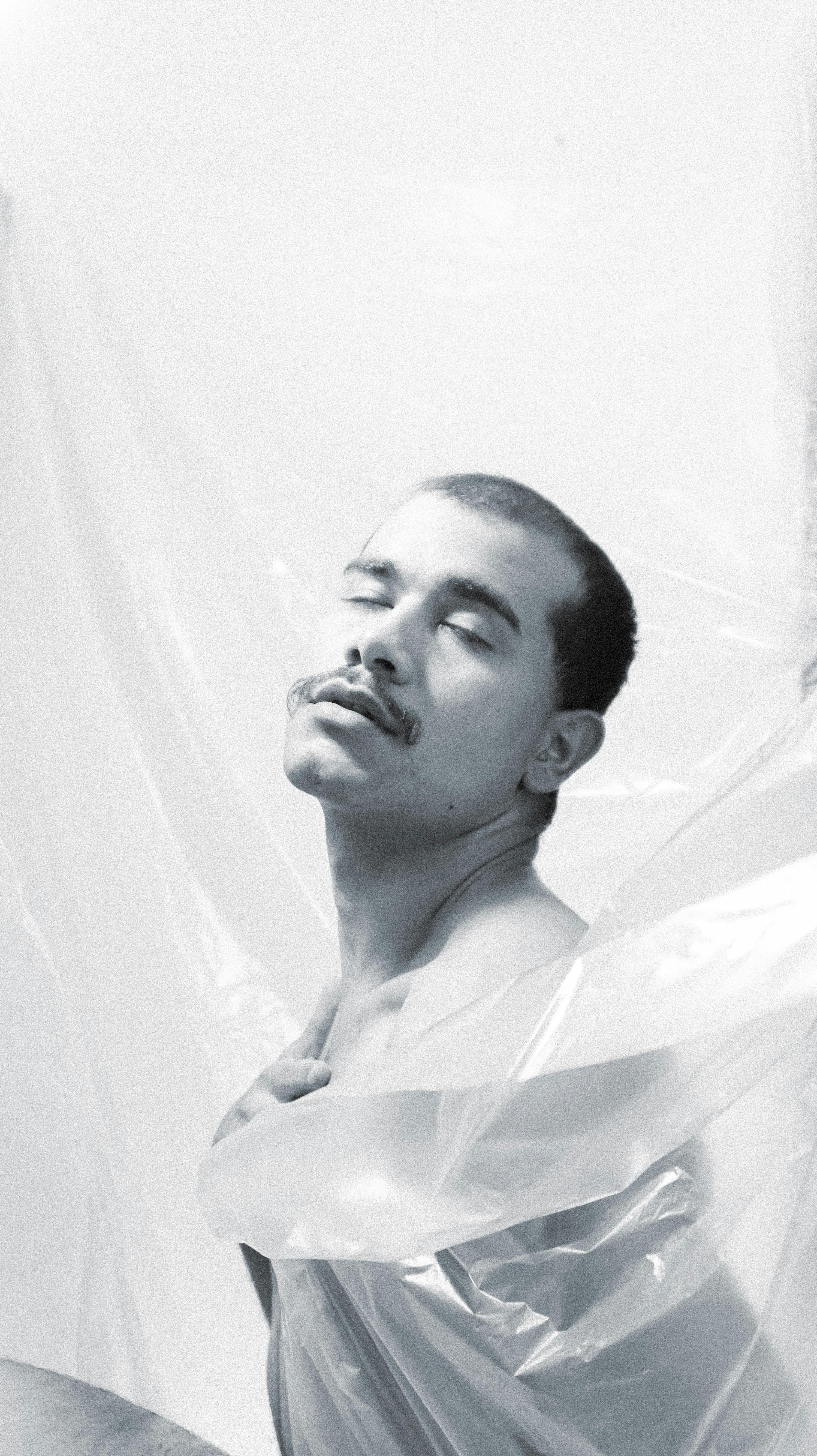 Portrait of a Shirtless Man Wearing Cellophane · Free Stock Photo