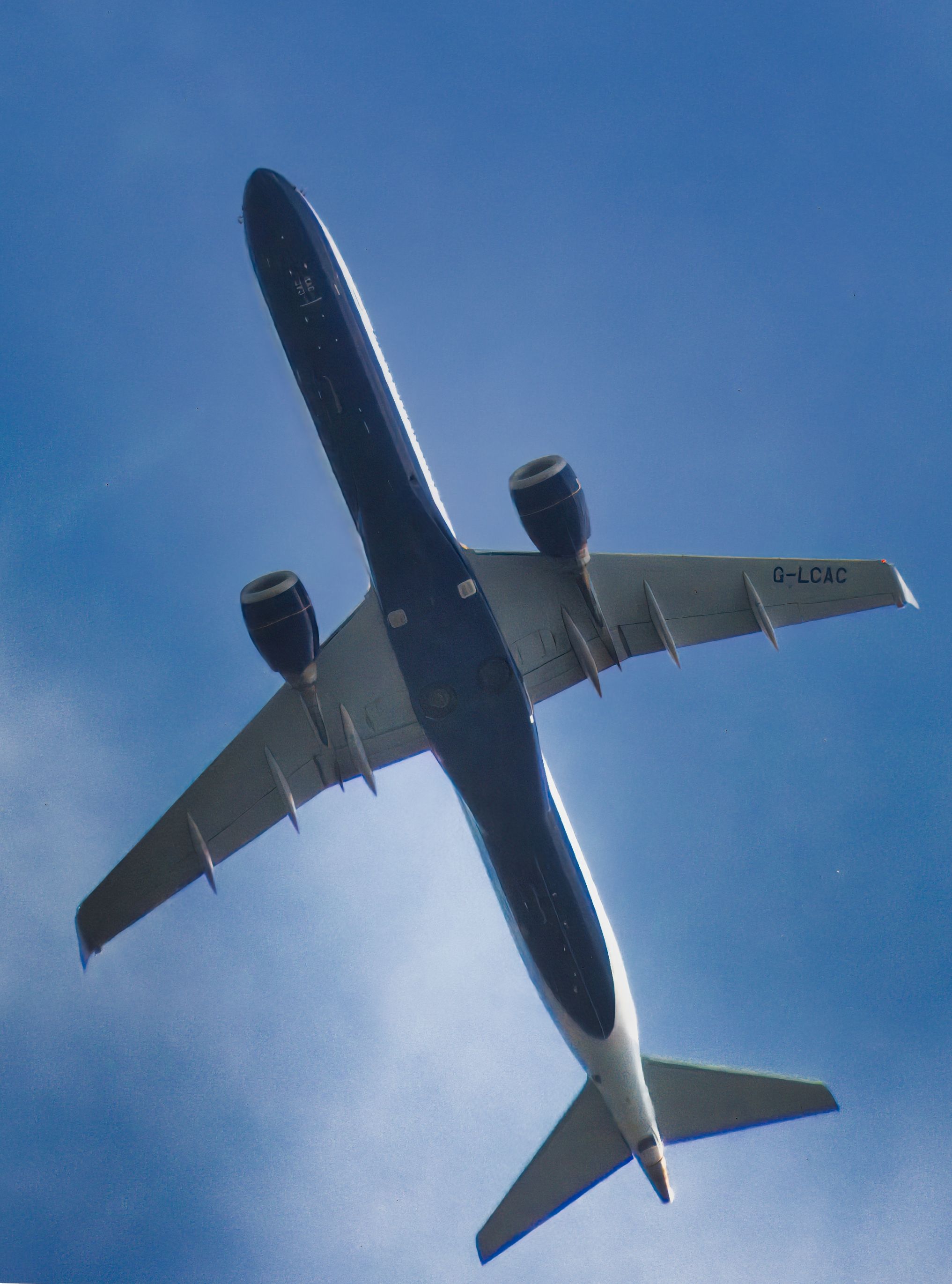 Airplane Near Blue and Grey Building · Free Stock Photo