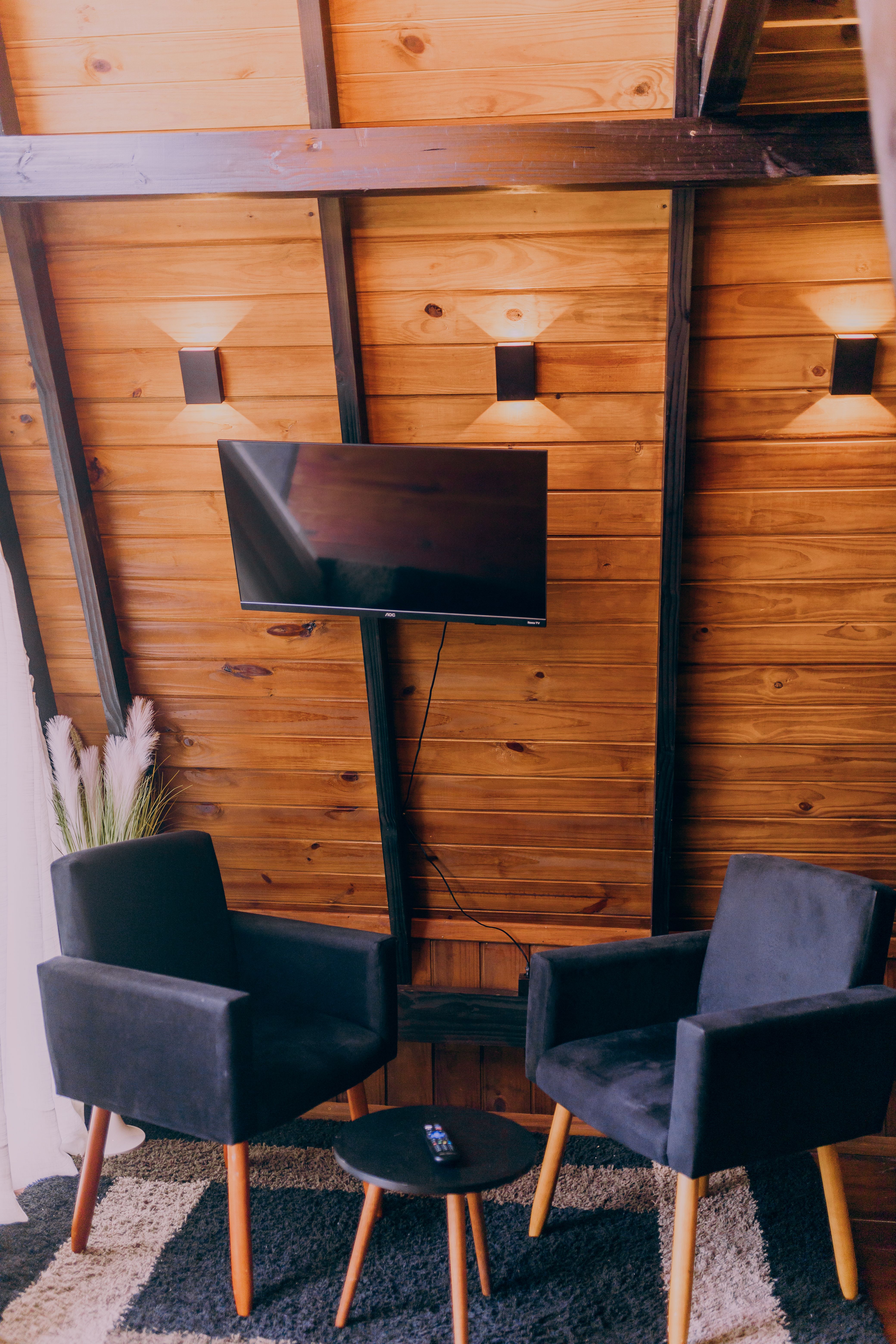 TV over Table and Chairs · Free Stock Photo