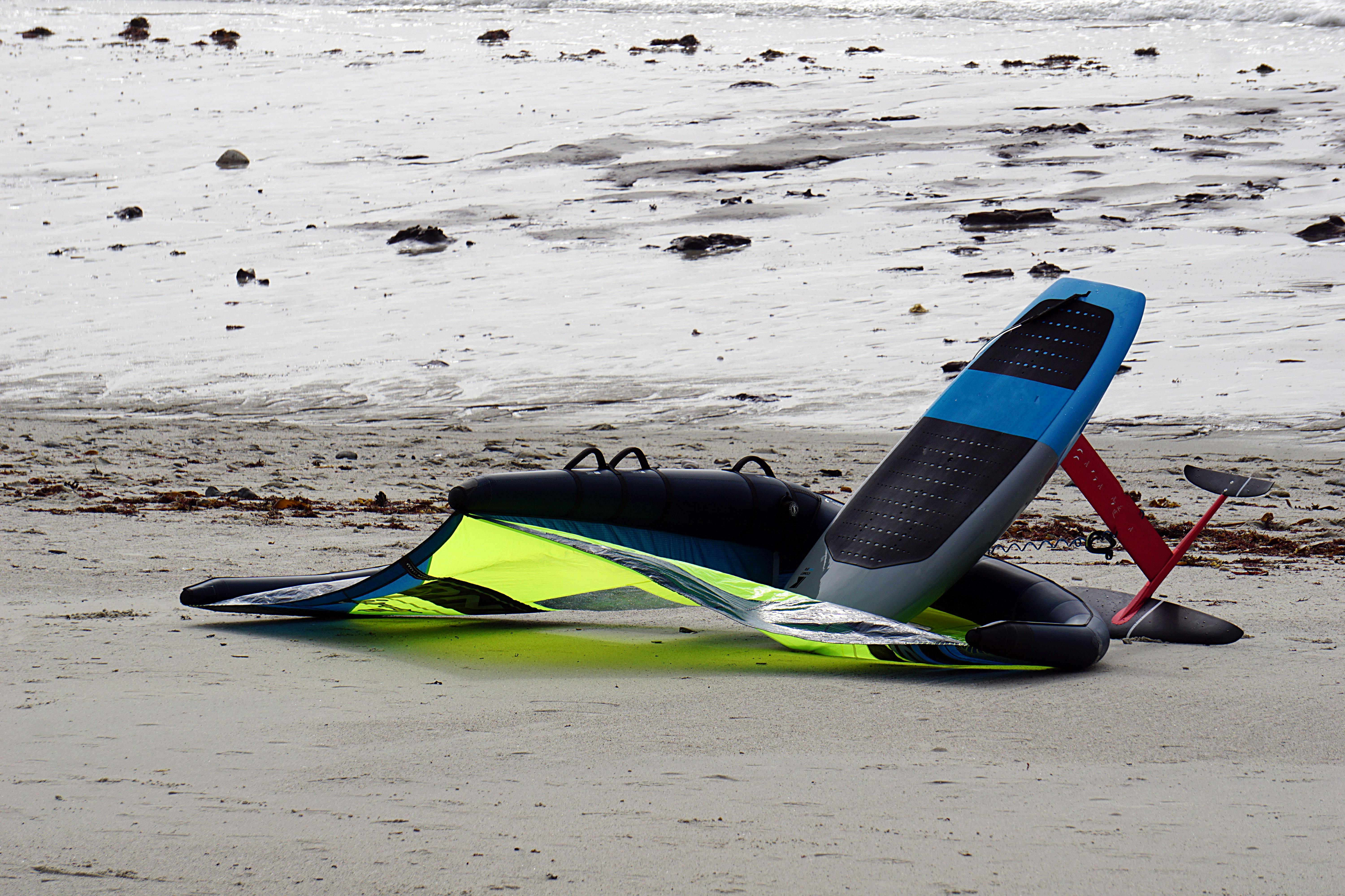 Kitesurfing Board and Sail at Beach · Free Stock Photo