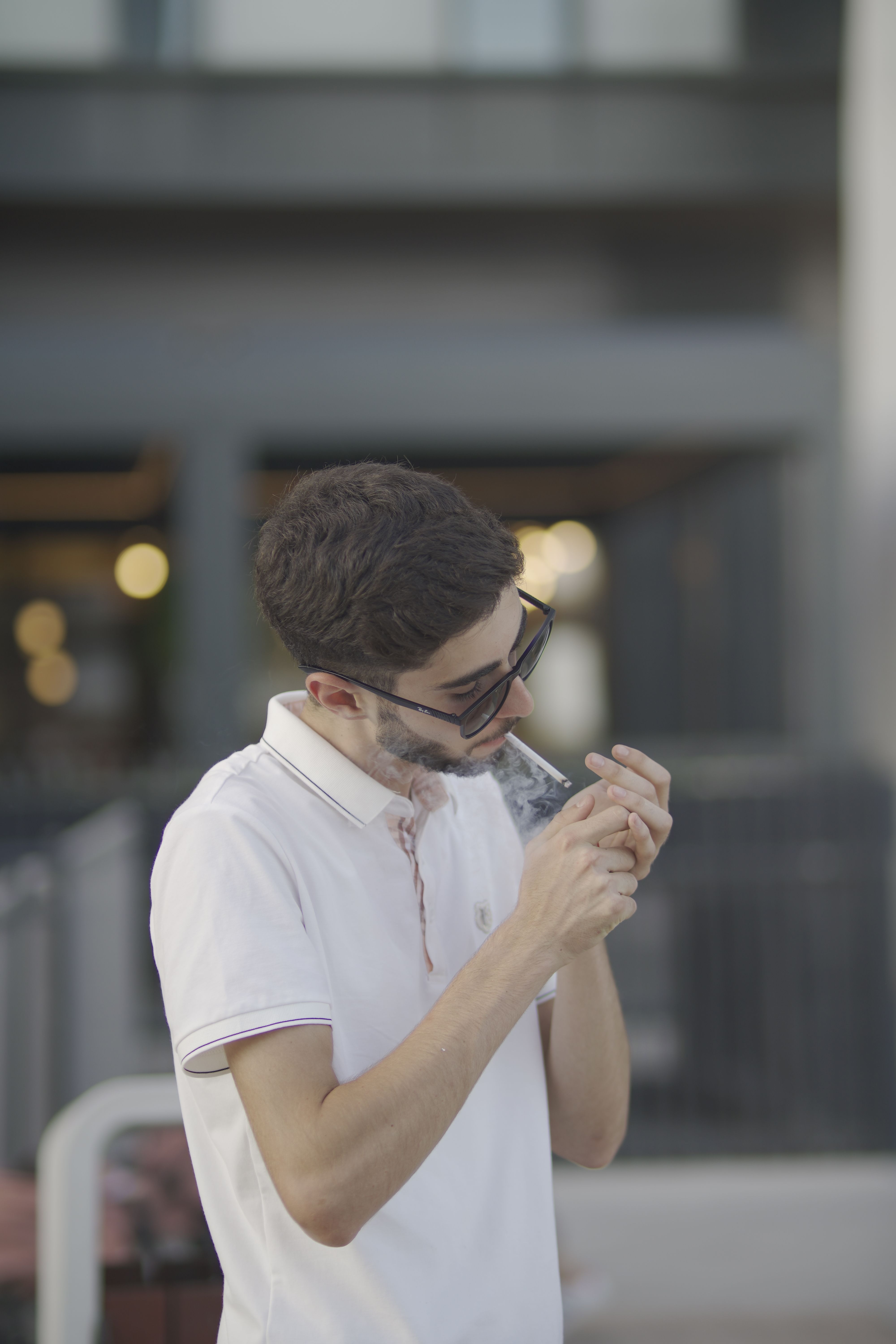 Young Man Smoking a Cigarette · Free Stock Photo