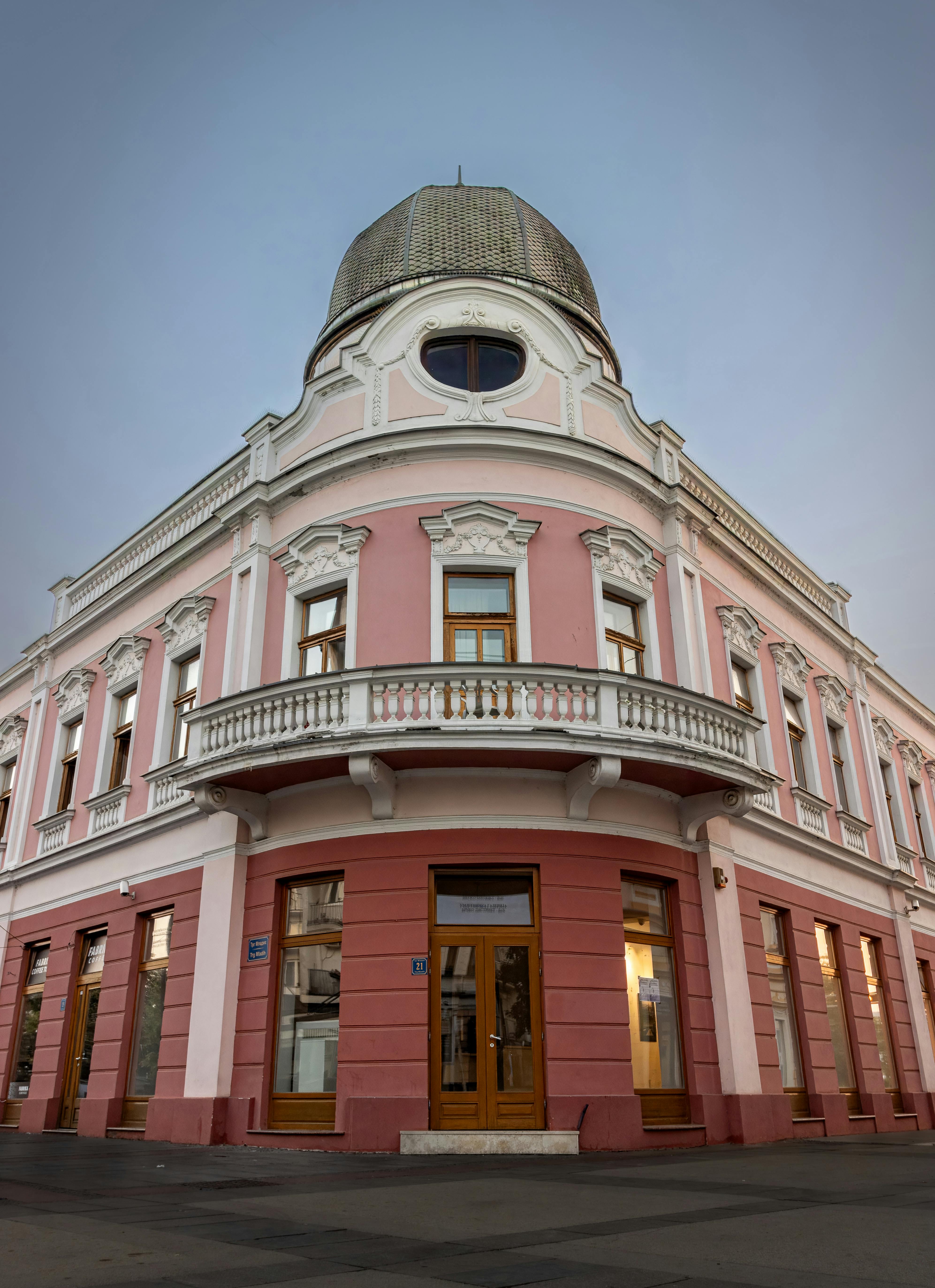 Balcony in Corner of Pink Building · Free Stock Photo