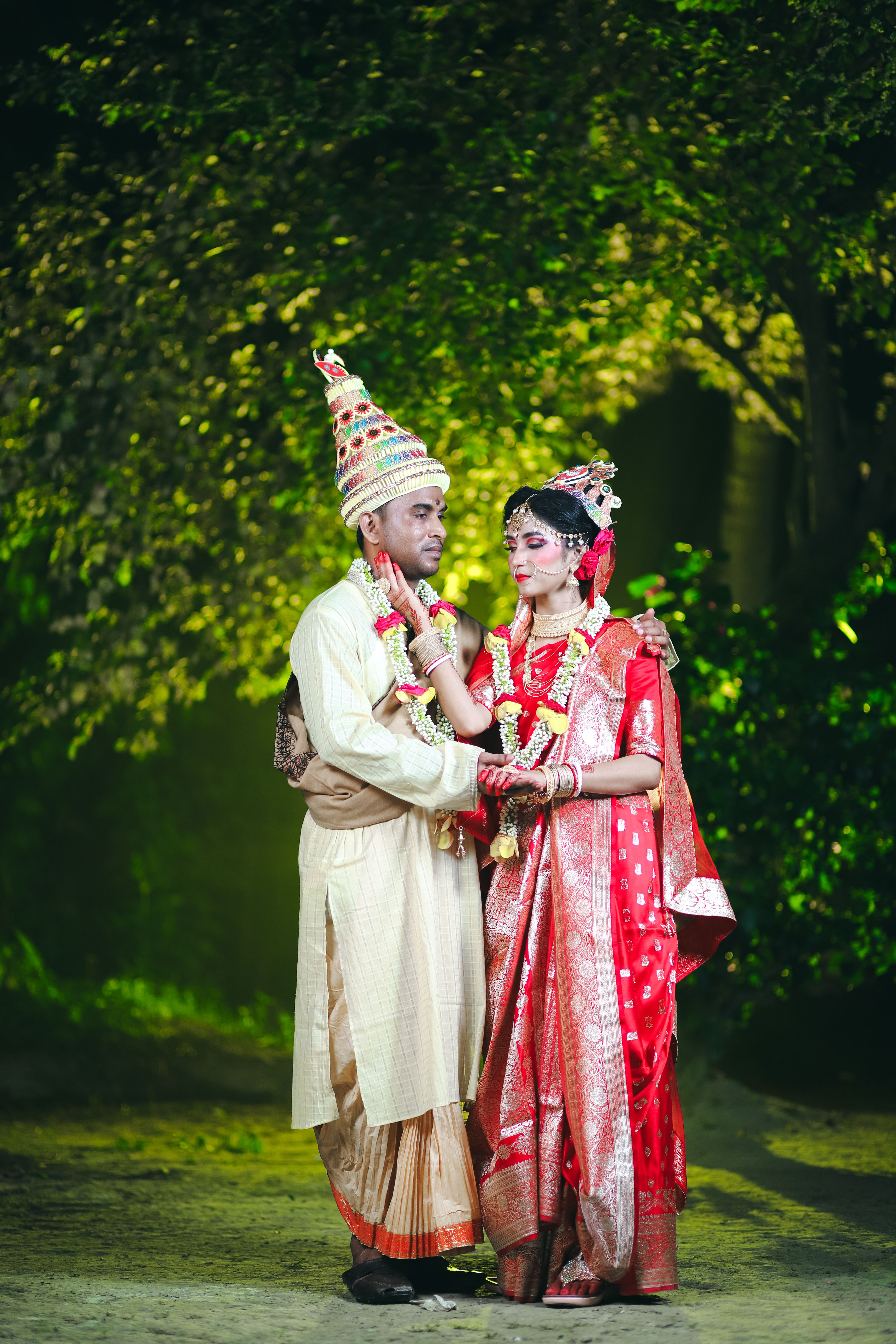 A couple in traditional indian attire standing in the dark · Free Stock ...
