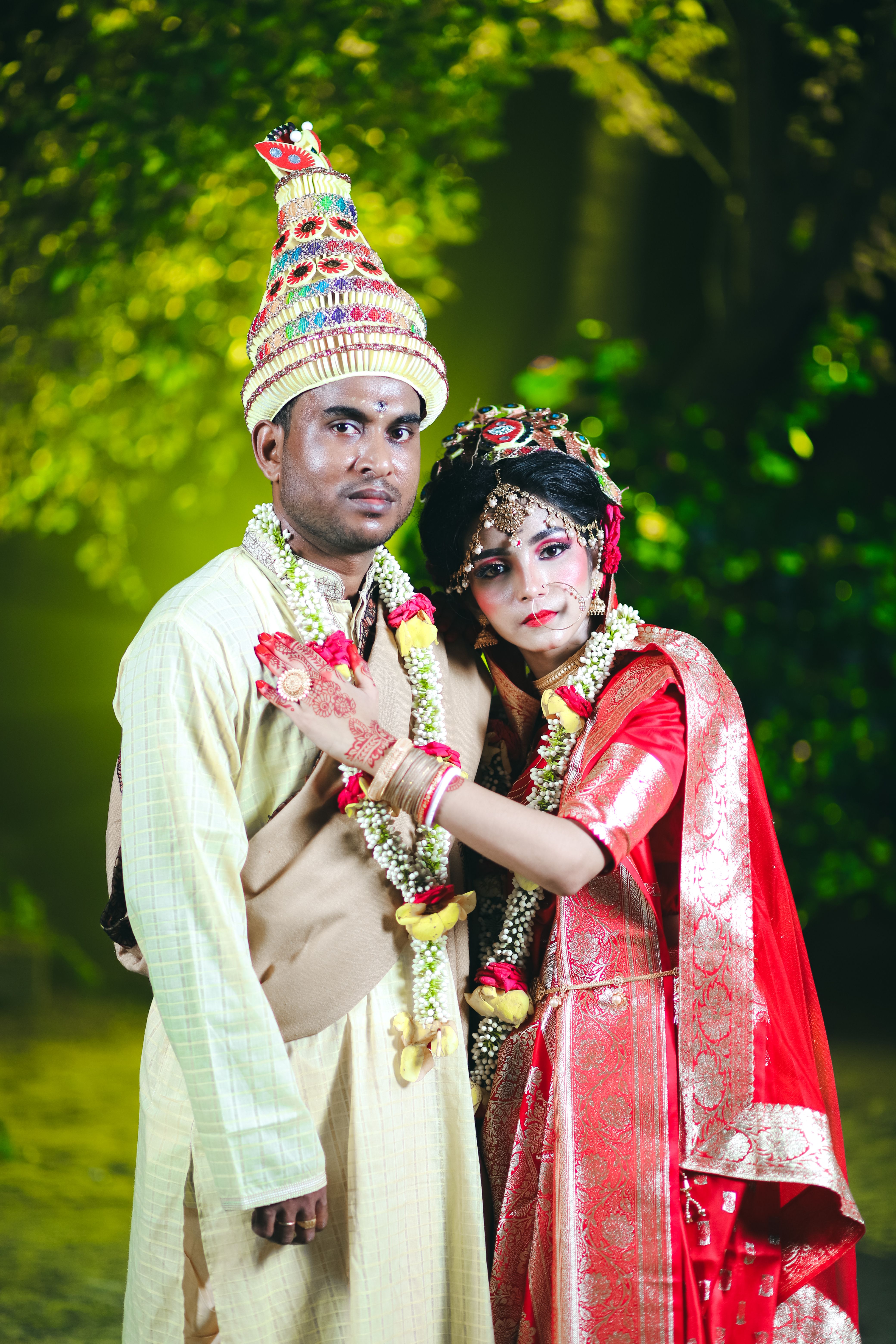The Bride and Groom Wearing Traditional Wedding Attire · Free Stock Photo