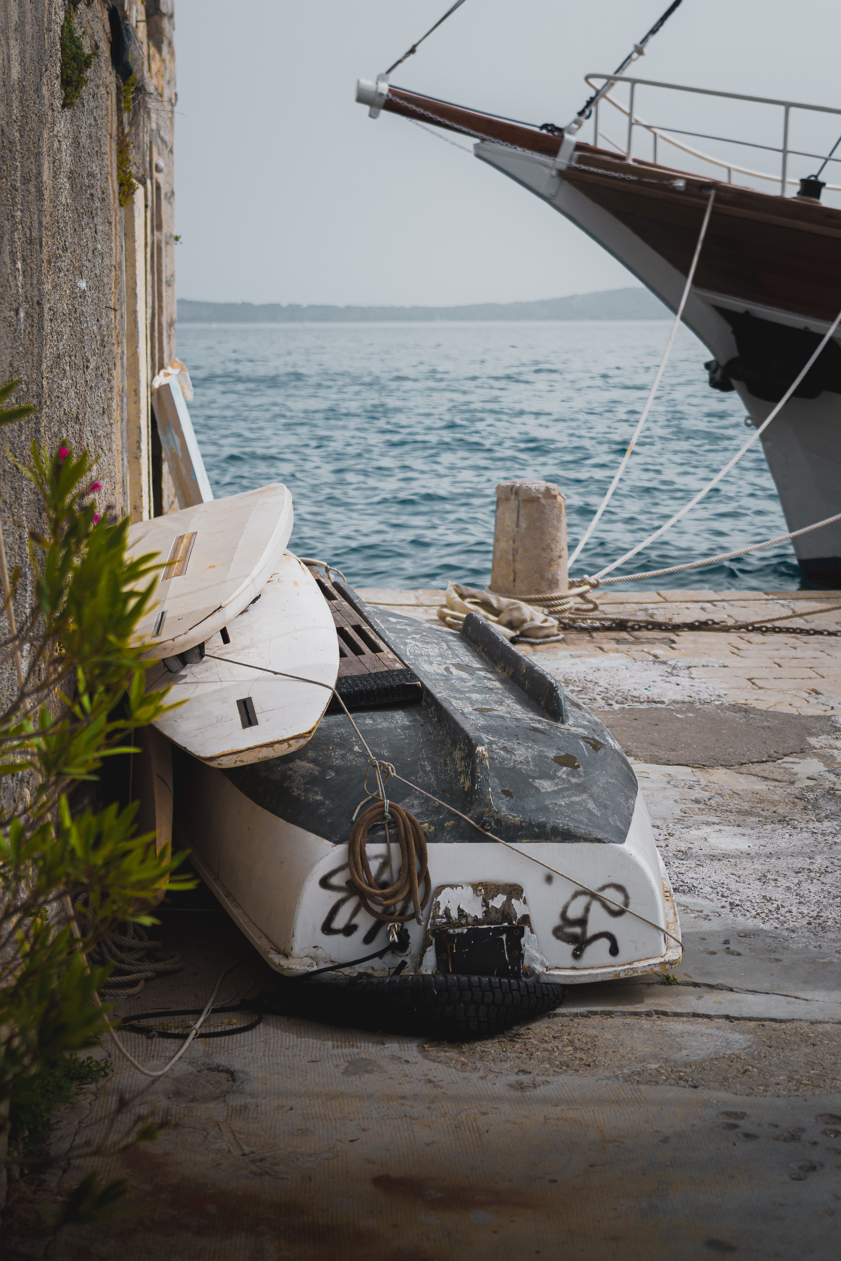Ship and Boat on Seashore · Free Stock Photo