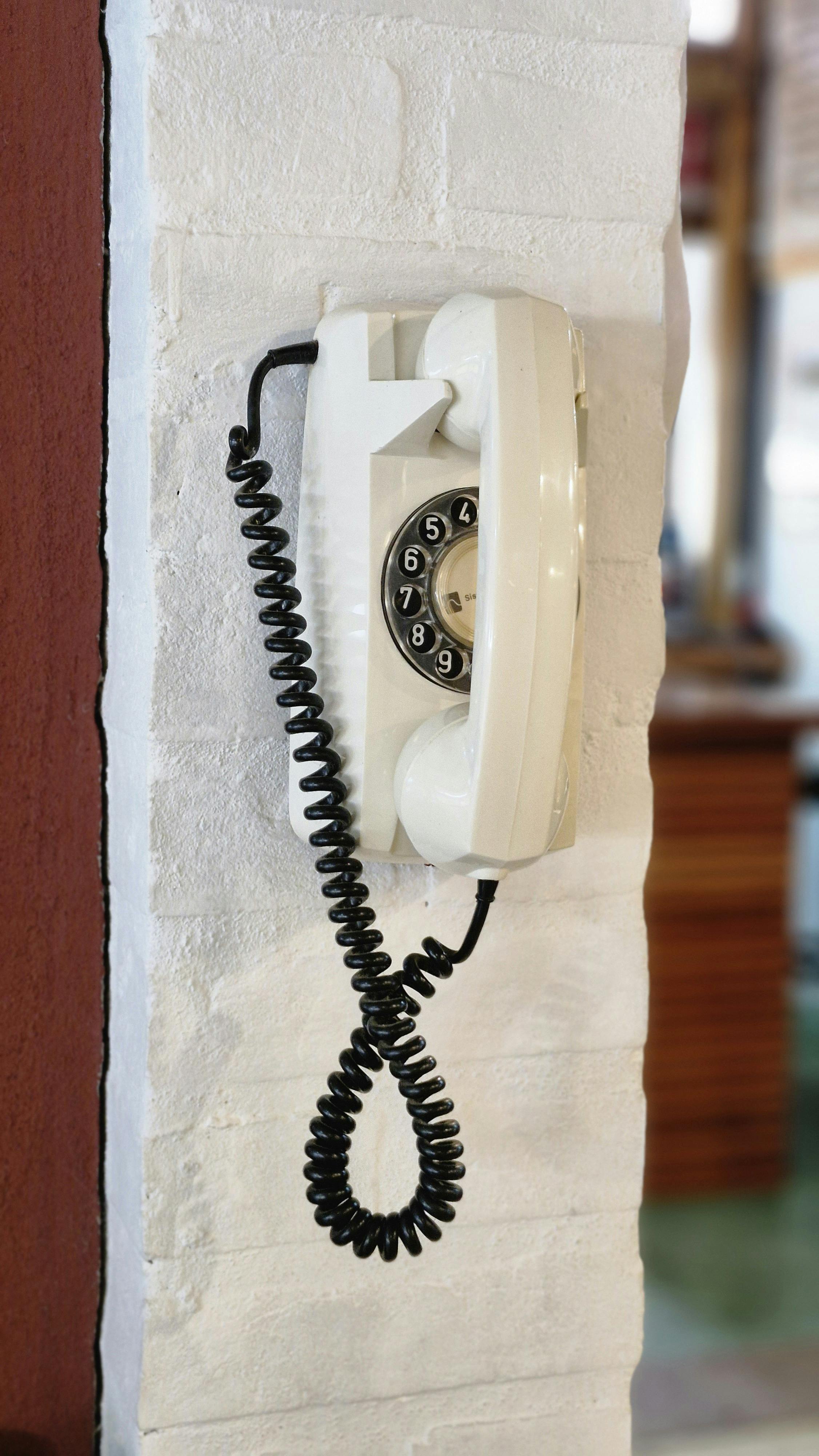 Vintage White Phone on a Wall · Free Stock Photo