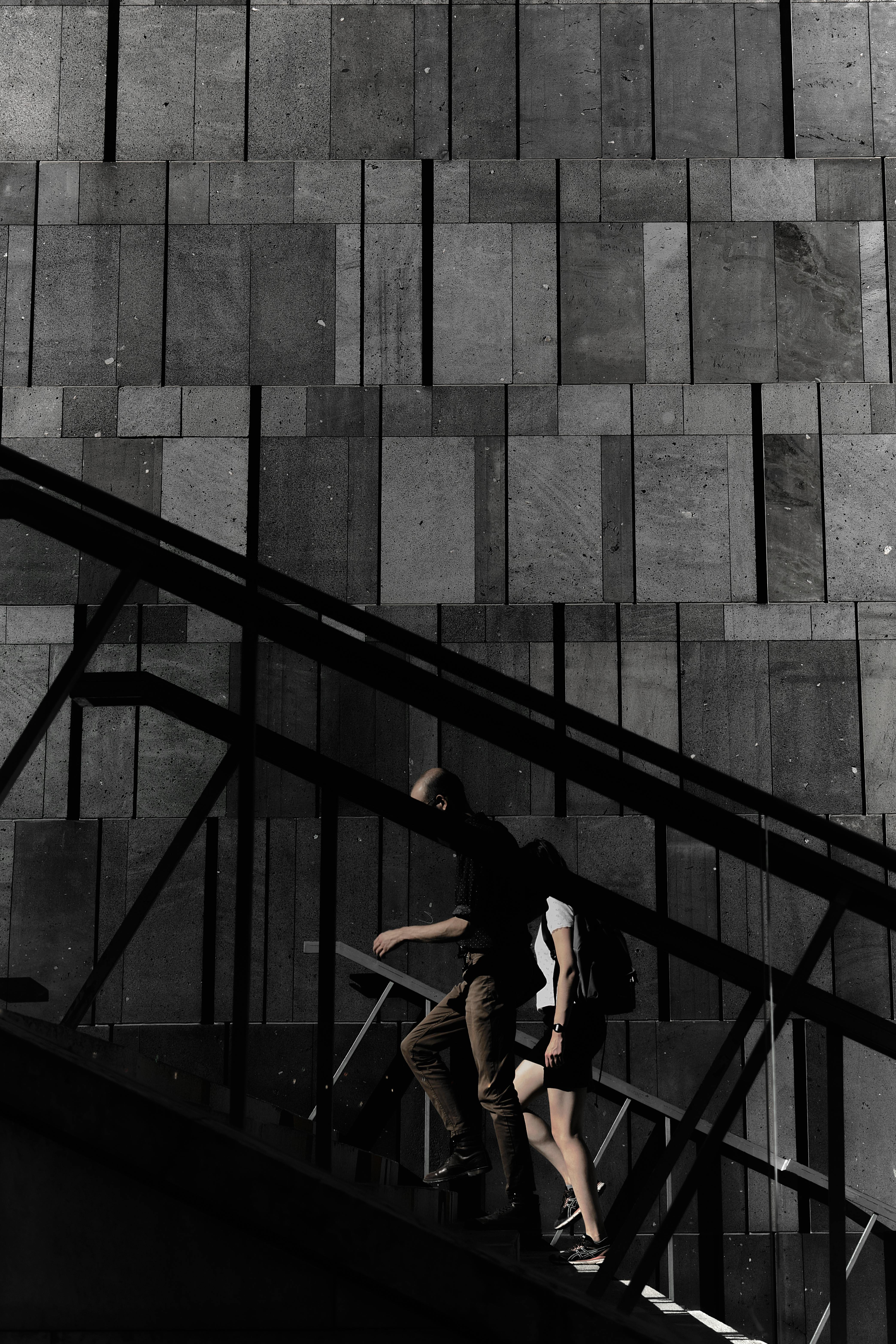 Man and Woman Climbing Steps · Free Stock Photo