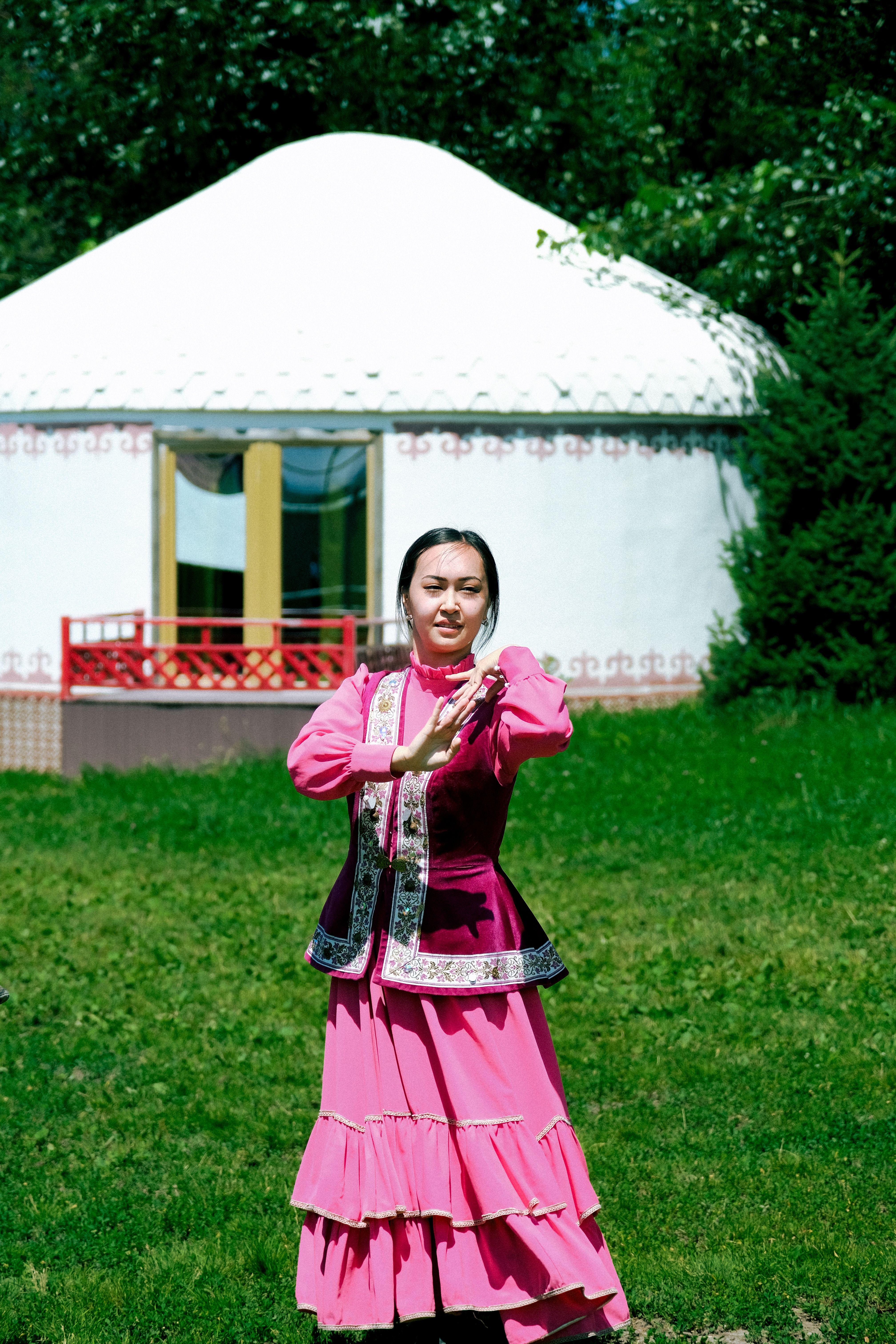 A Woman in Traditional Clothing Standing in Front of a Yurt · Free ...