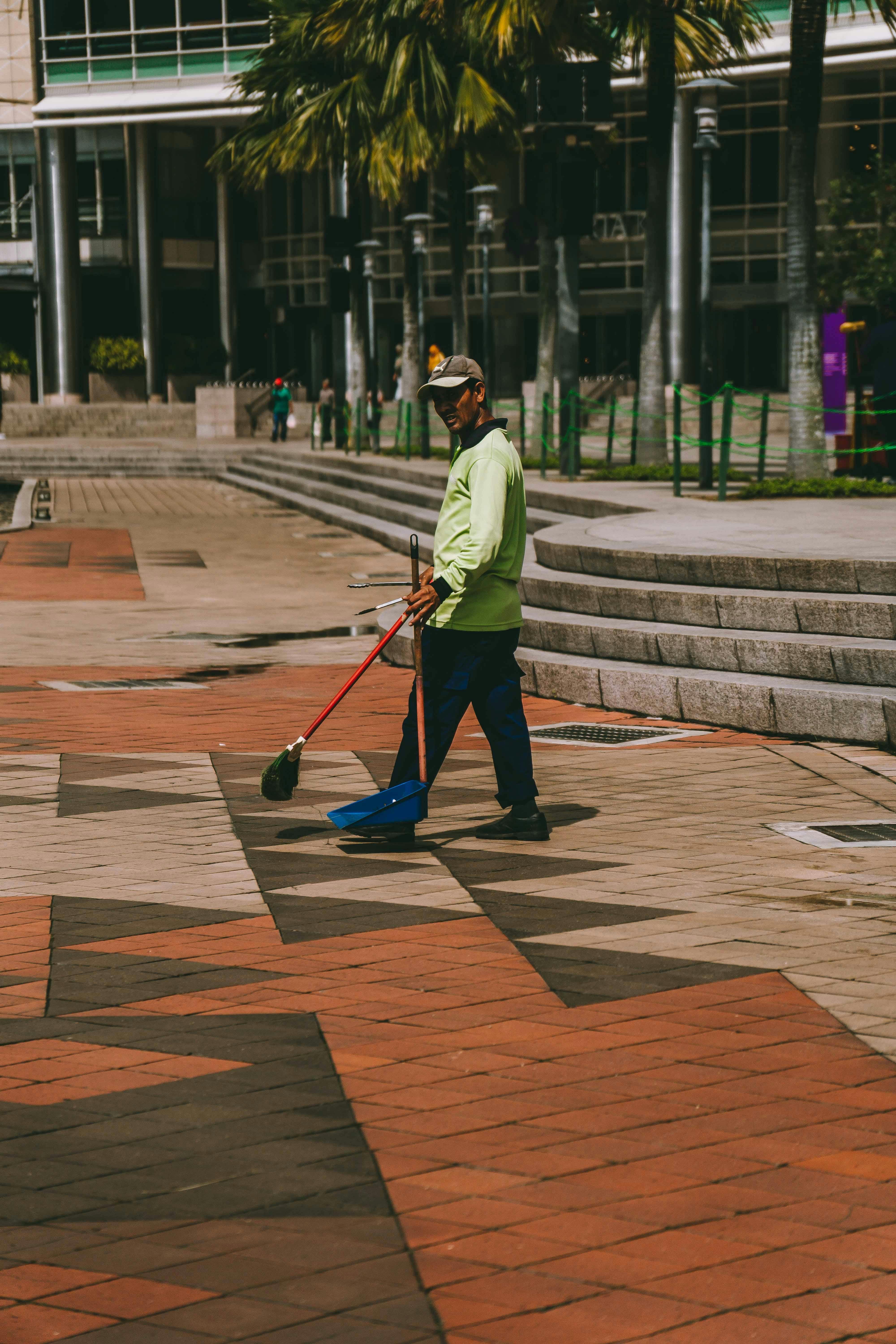 A Man Cleaning the Street · Free Stock Photo