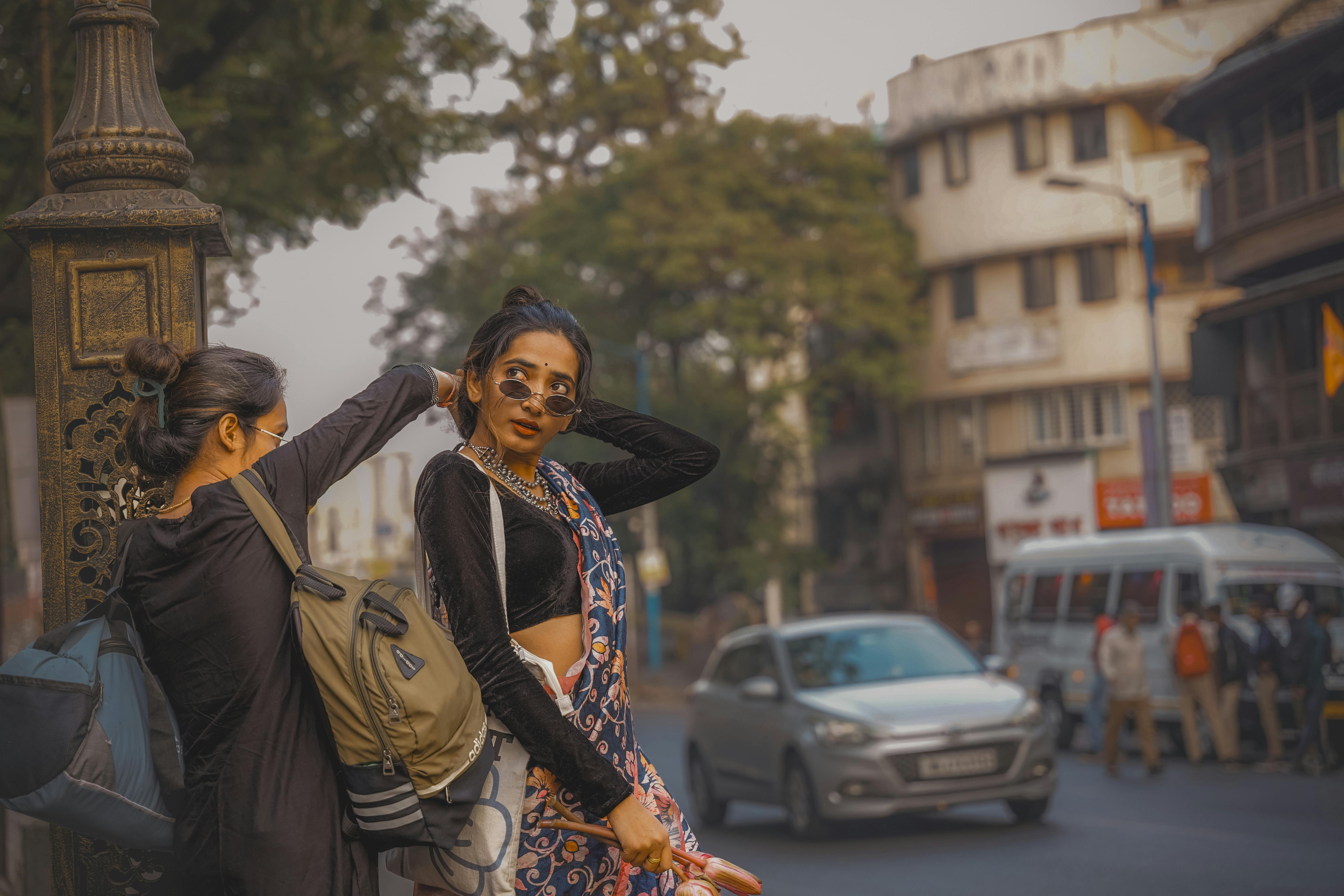 model in saree walking along road · Free Stock Photo