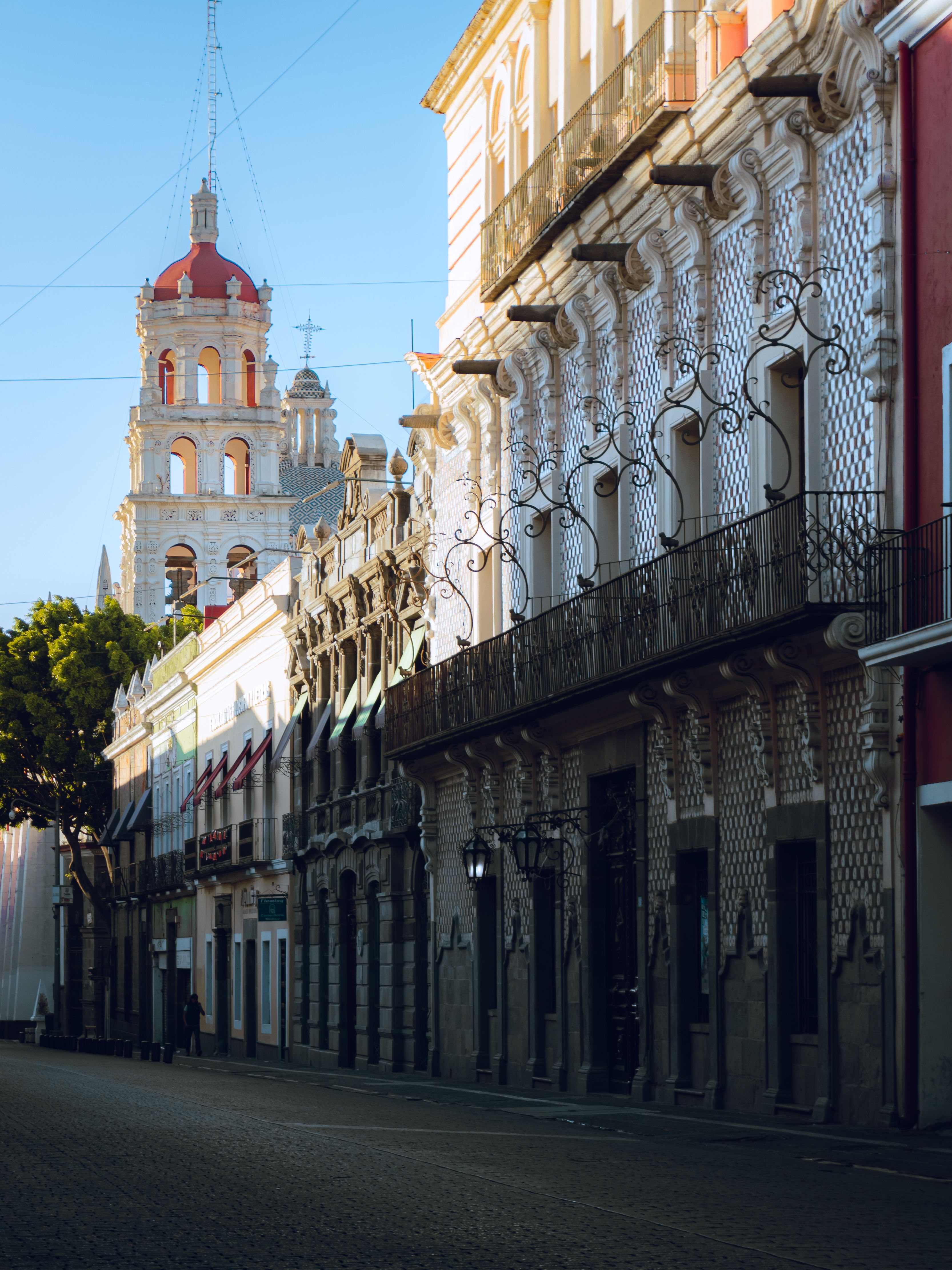 A street with buildings and a church tower · Free Stock Photo