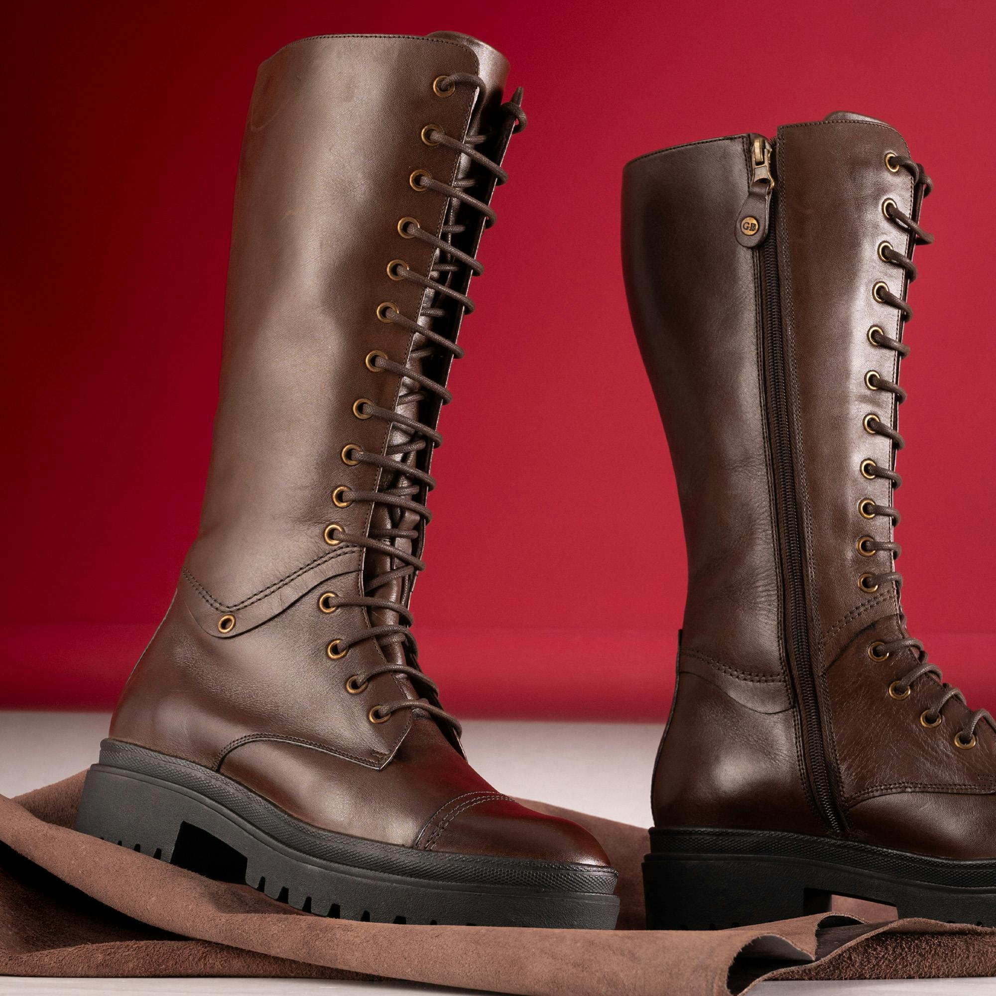 Leather Boots on Red Background · Free Stock Photo