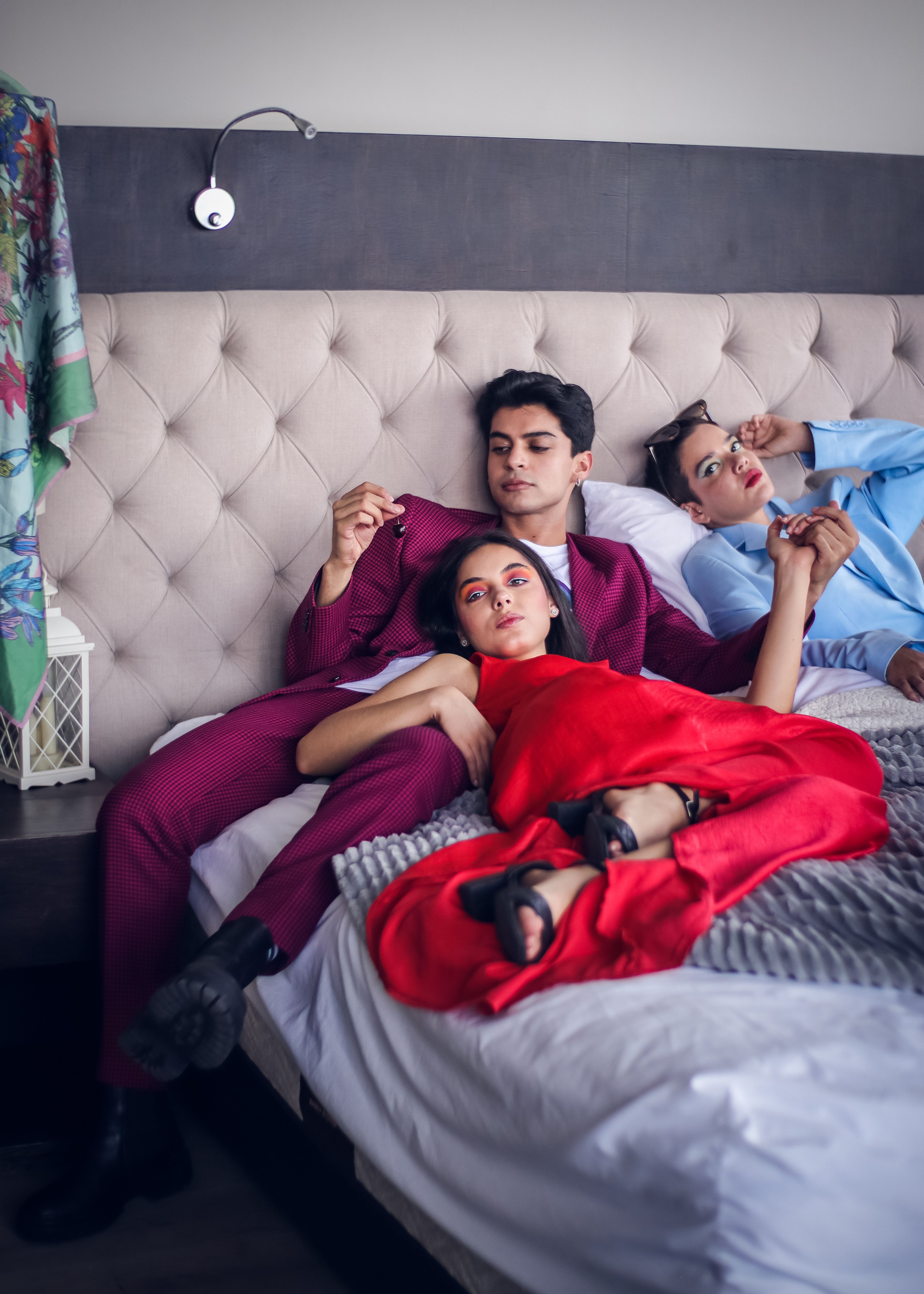 Young People in Elegant Clothing Posing Lying in Bed Together · Free ...