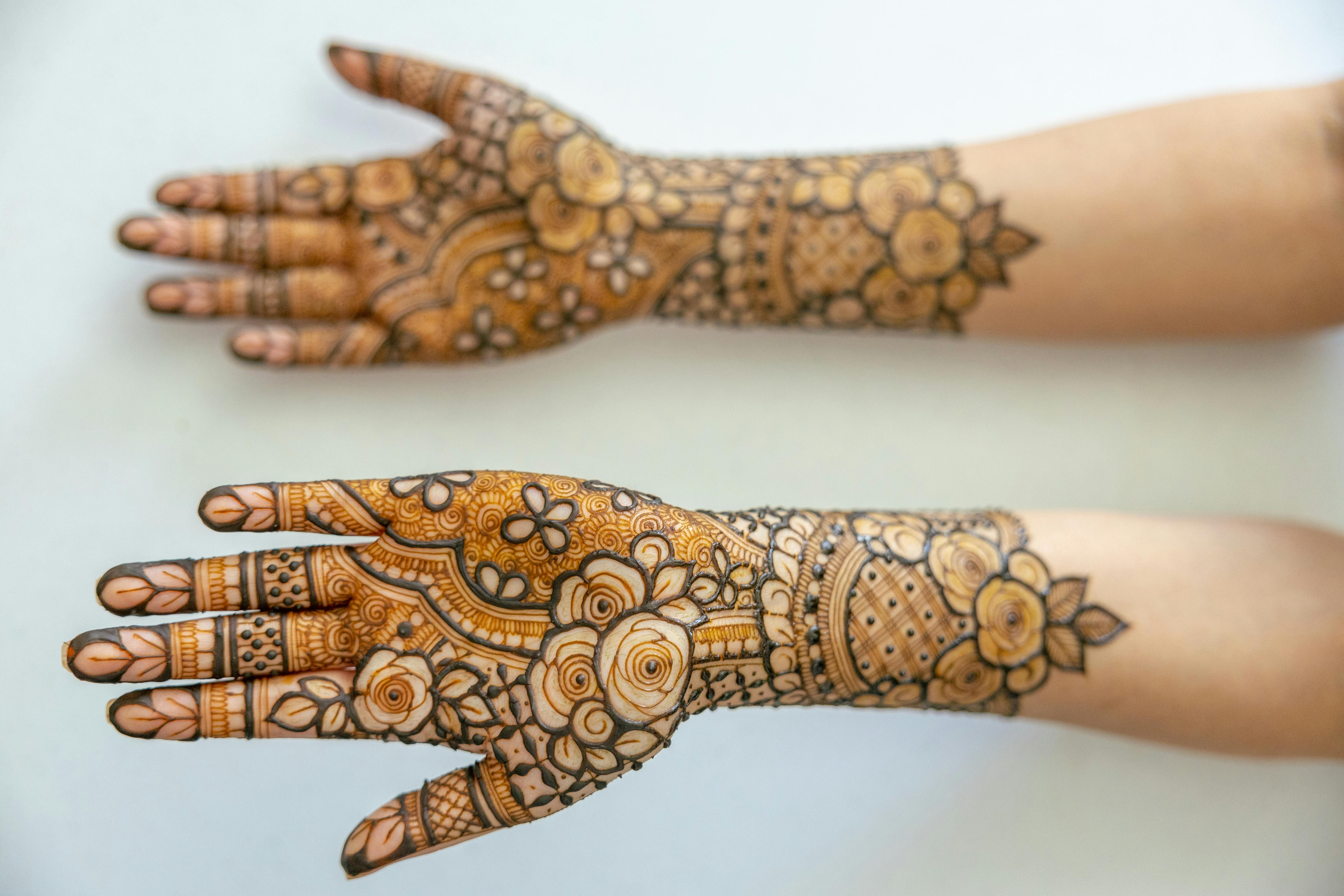 Traditional Floral Design Henna Tattoo on a Woman's Hand · Free Stock Photo